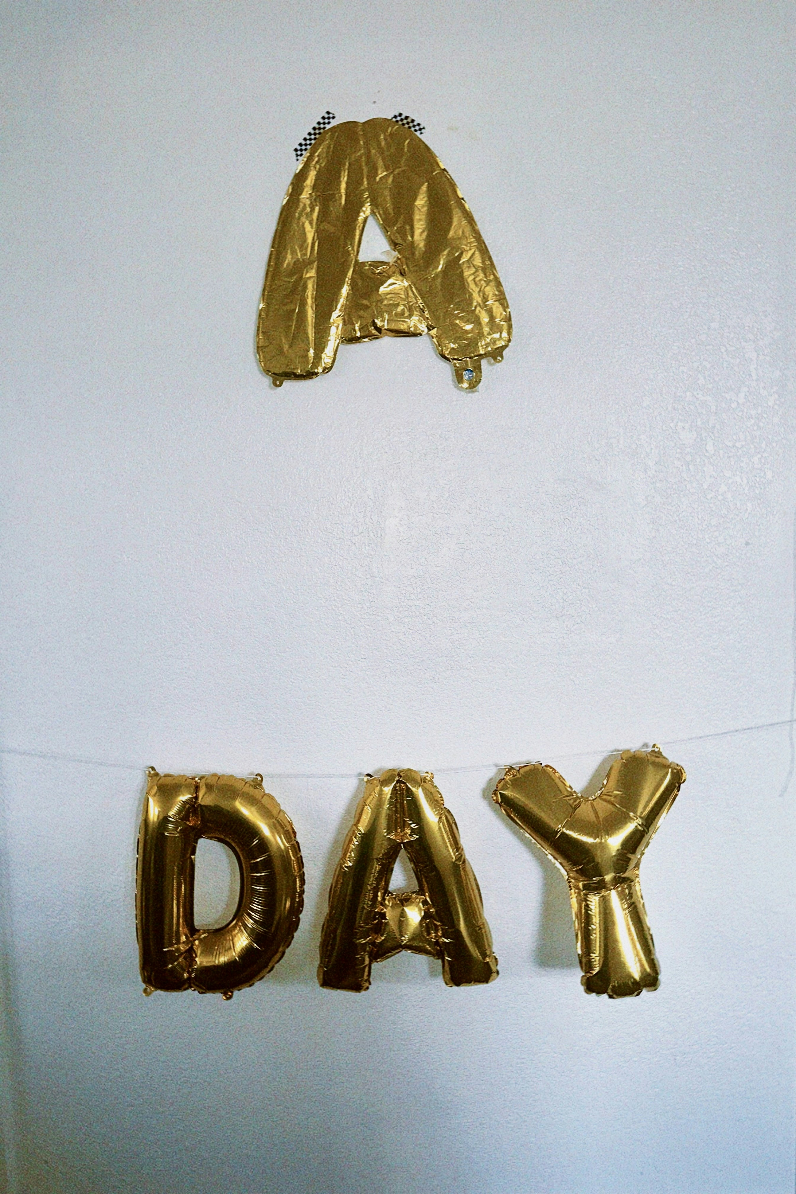 Gold Balloon Letters Form a Simple Birthday Moment