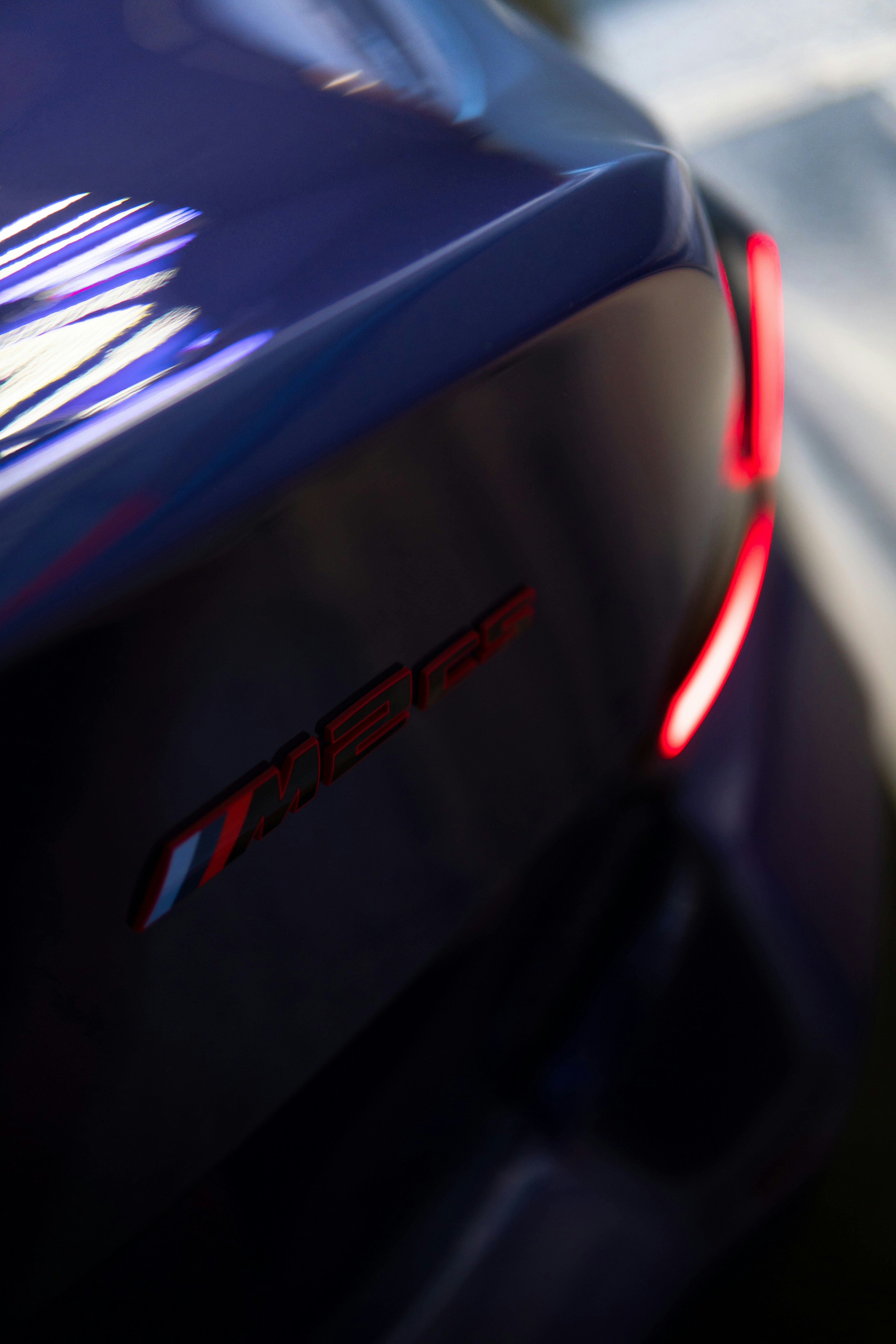 Rear Glow: M Badge in a Midnight Blur