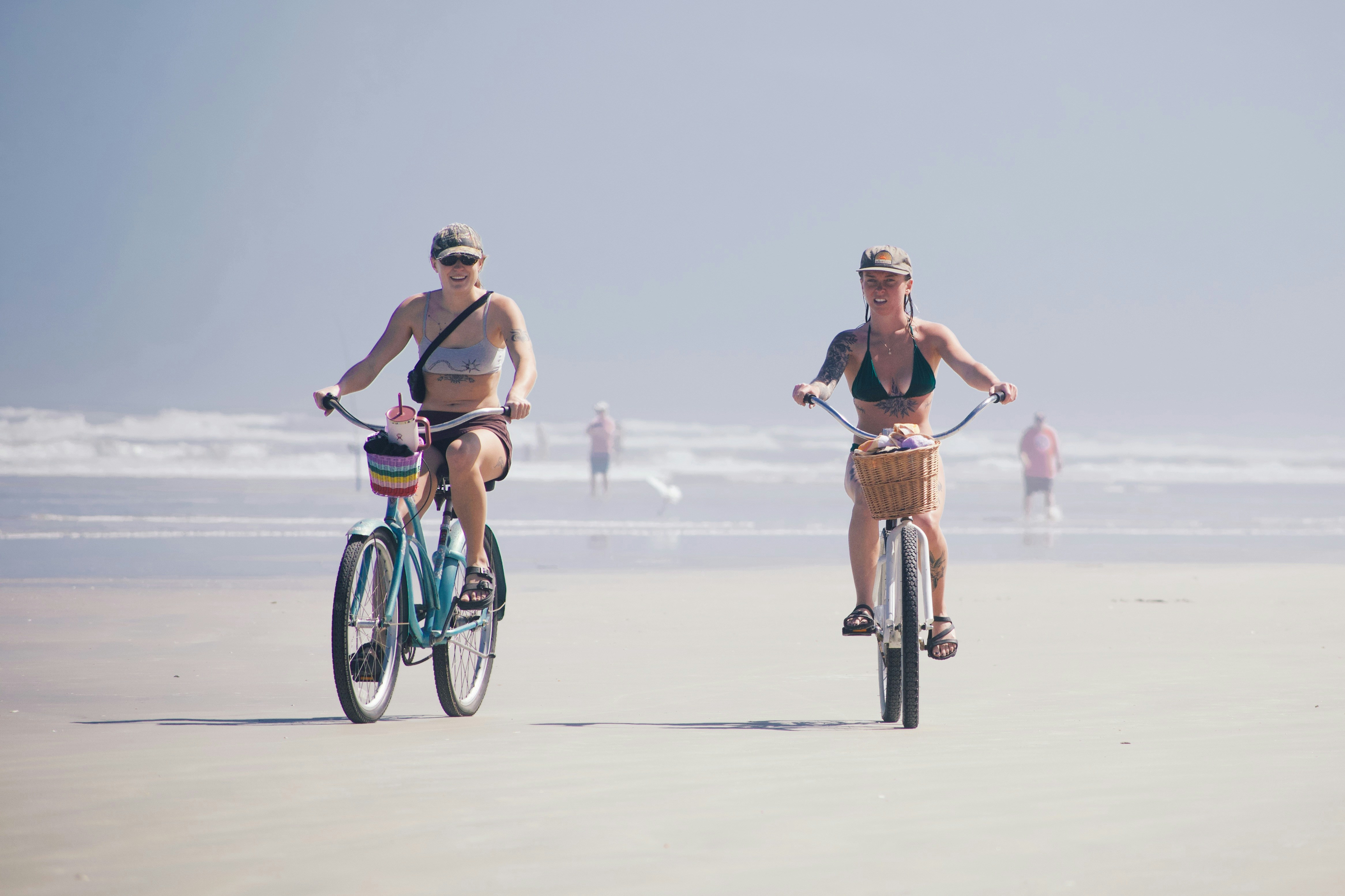 Coastal Ride: Bicyclists Span a Misty Beach