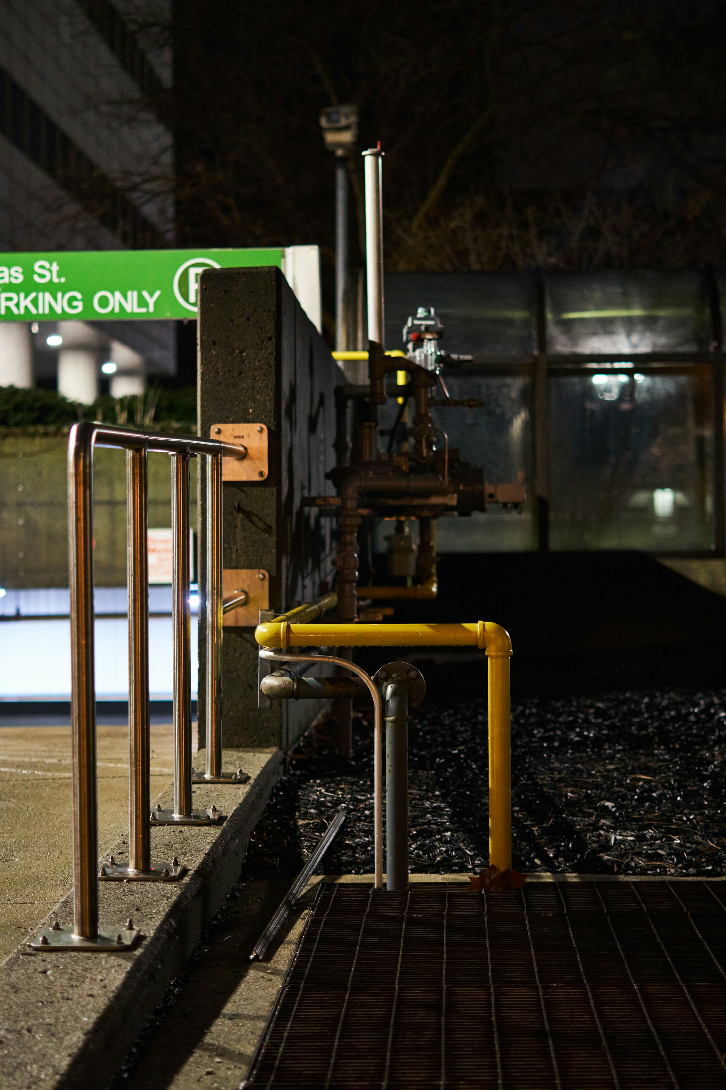 Yellow Gas Pipe Echoes at a Dimly Lit Facility