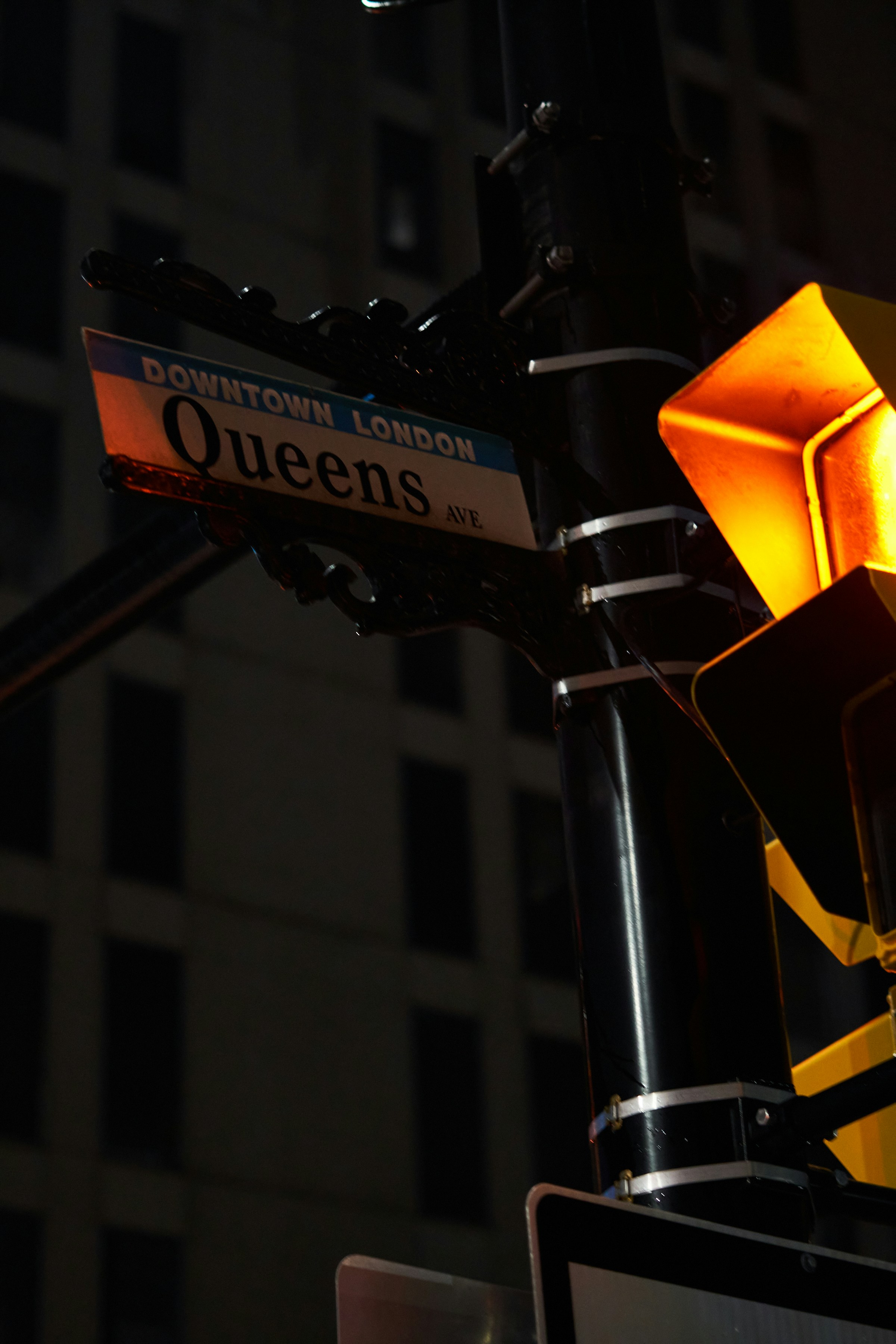 Queens Ave at Night: A Neon Sign and Streetlight Moment