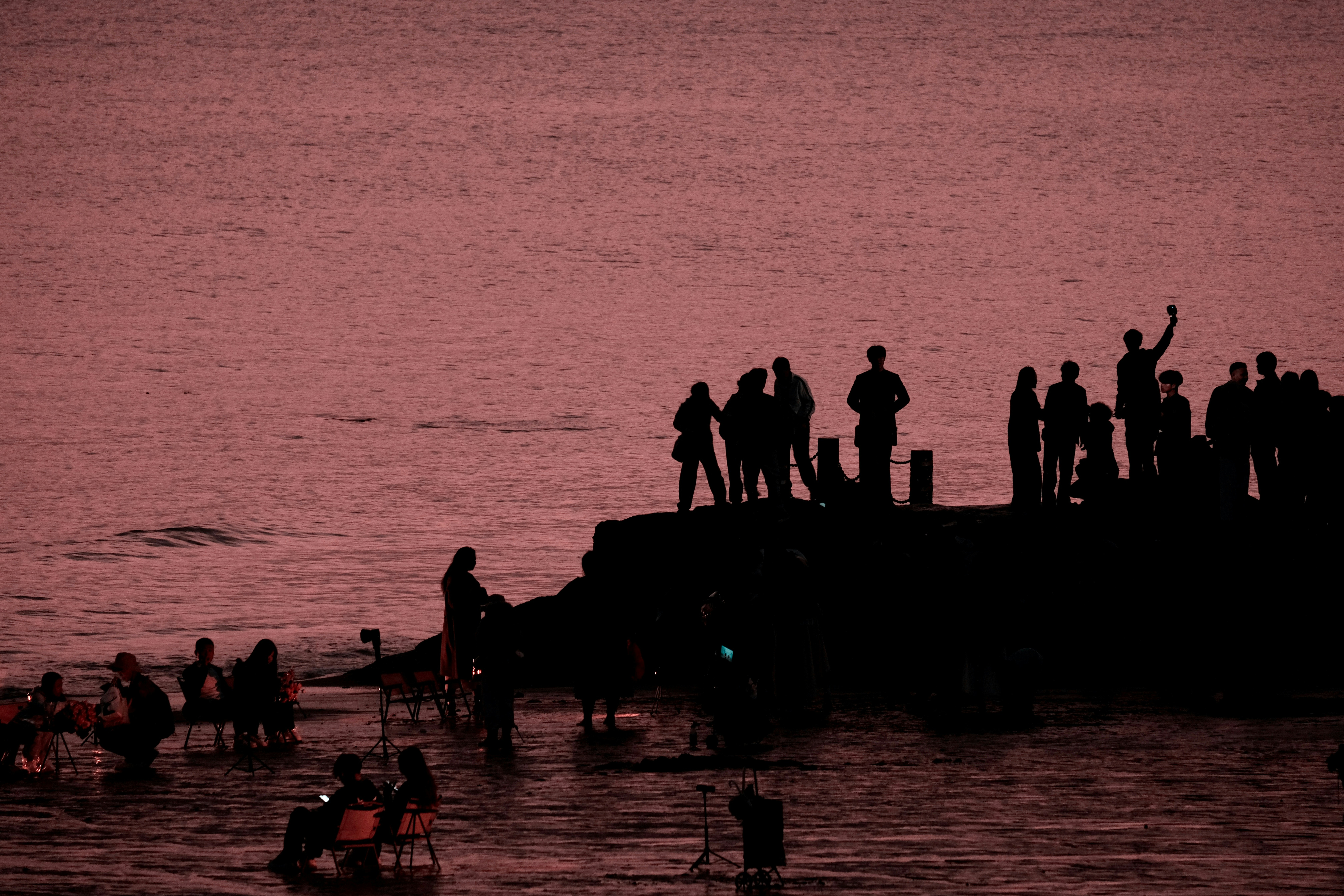 Twilight Silhouette Harbor: A Crowd on the Pier