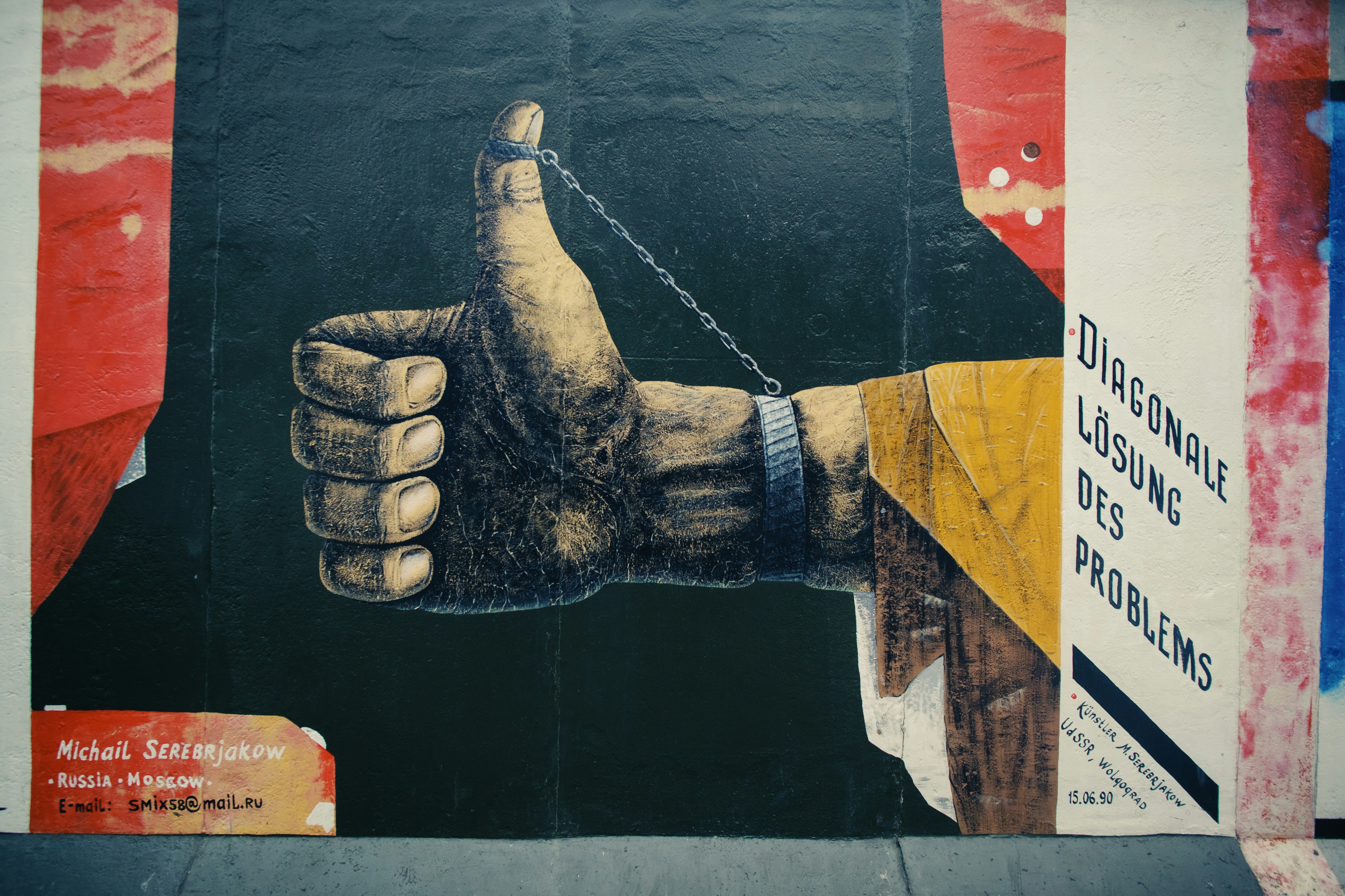 Thumbs Up on a Chain: A Bold Street Mural