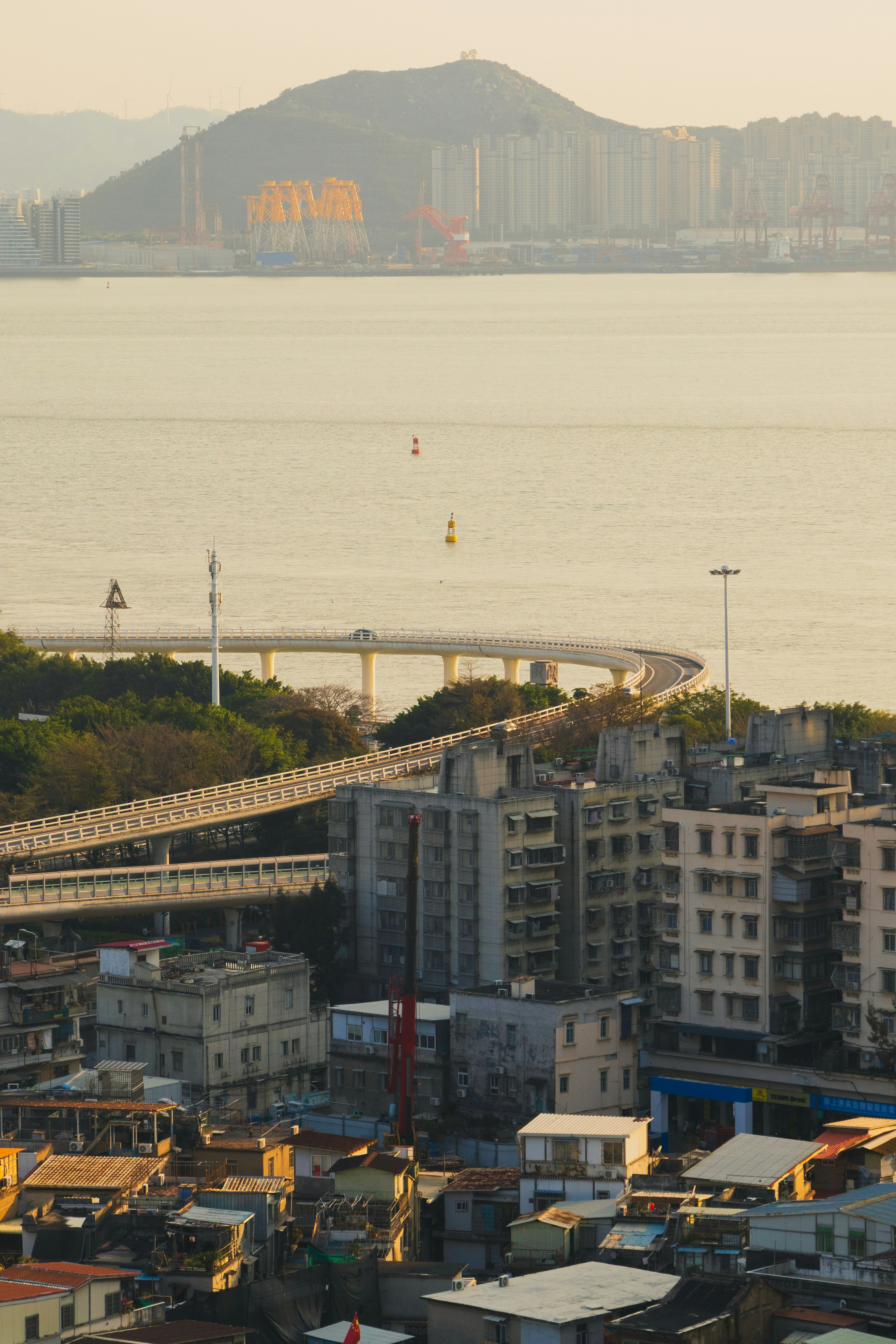 A Coastal City Spiral: Roads, Water, and Distant Hills