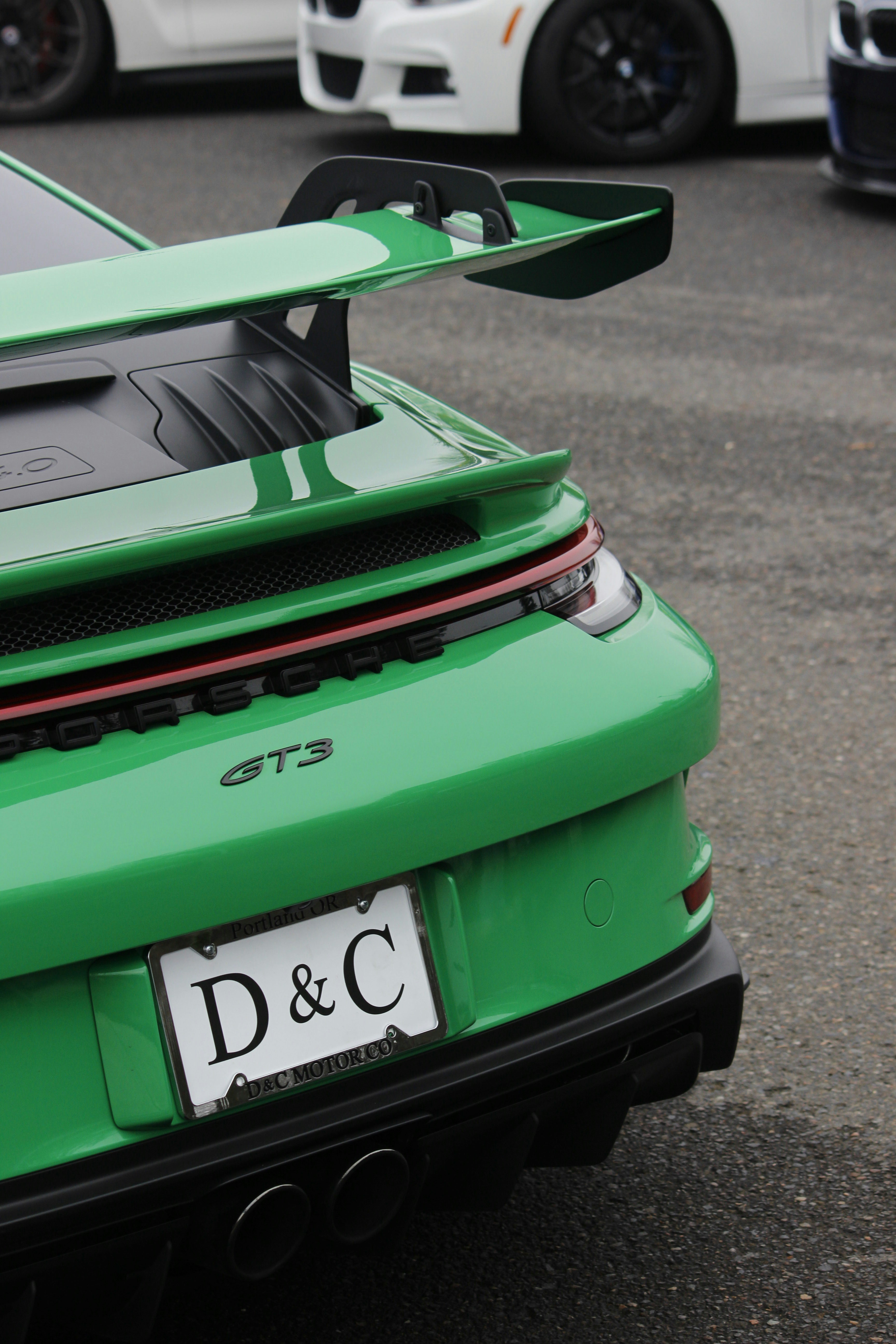 Green Porsche GT3: Rear Wing and Tail Design in Focus