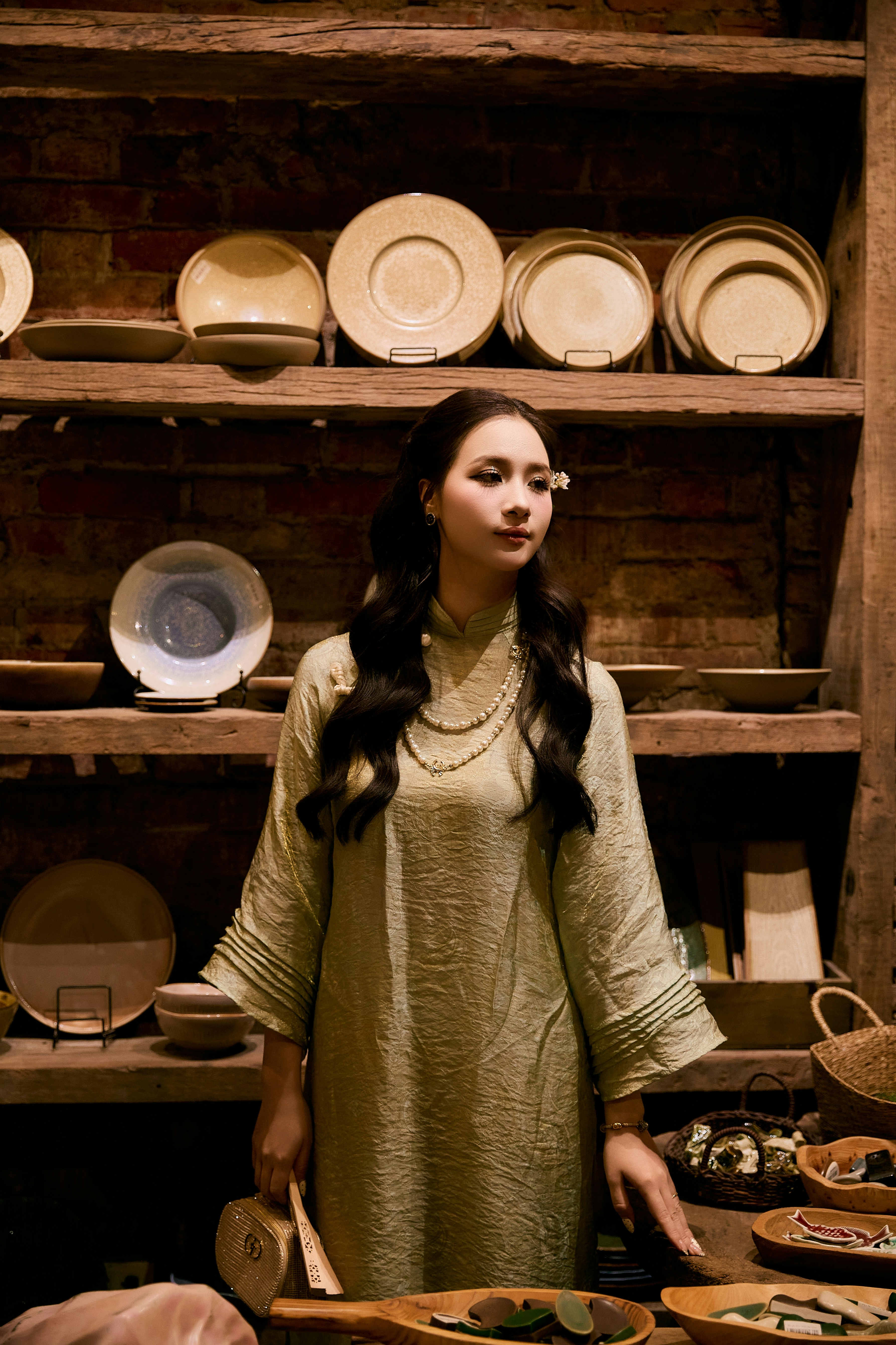 Ceramic shelves and grace: a portrait of quiet elegance in pottery-lit glow