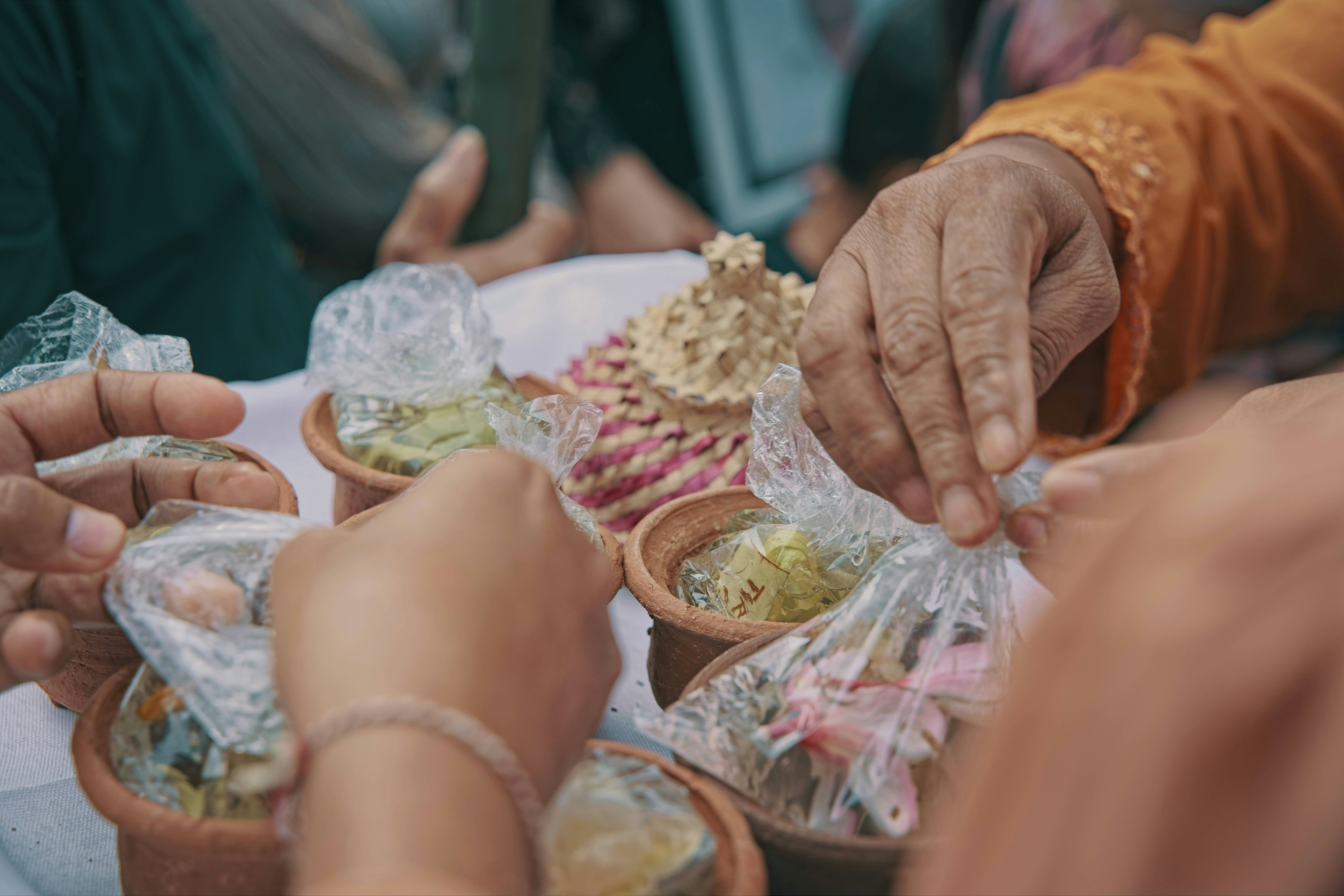 Hands and Sugar Pearls: a communal moment around small clay cups