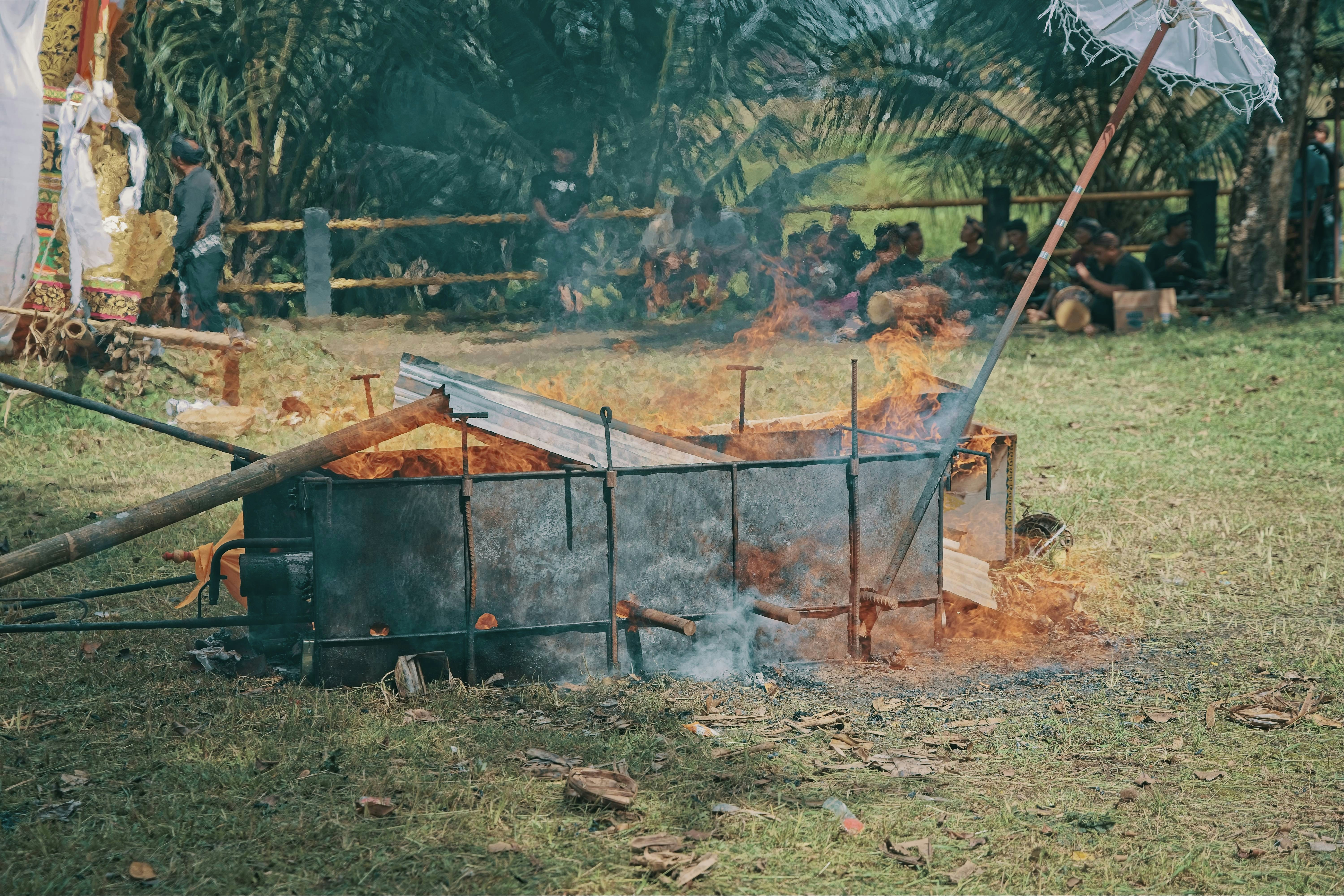 Boiling Pot and Gathered Crowd: A Rural Fire Pit Scene