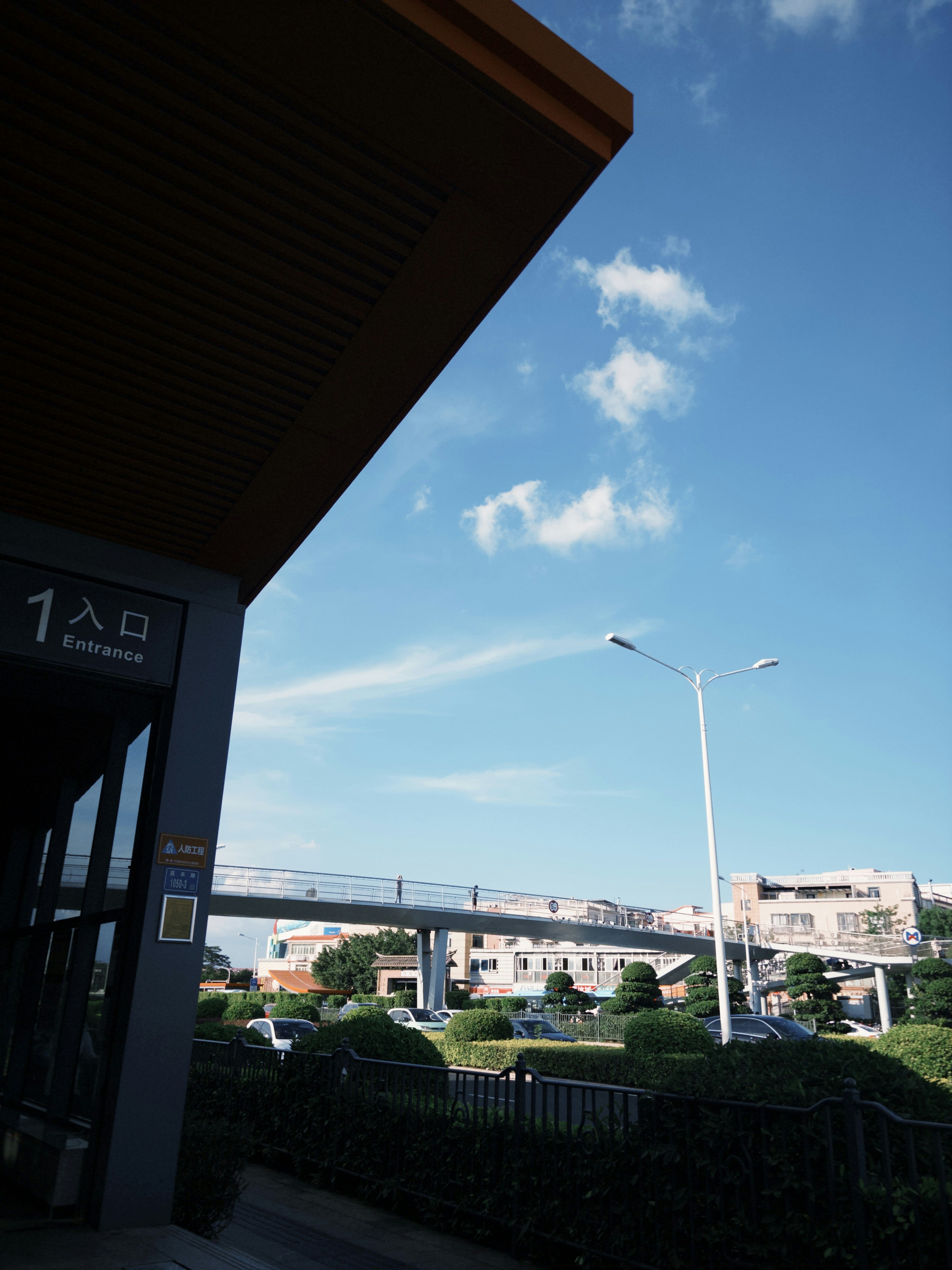 Architectural Overhang and Skyline: A Day at the Entrance