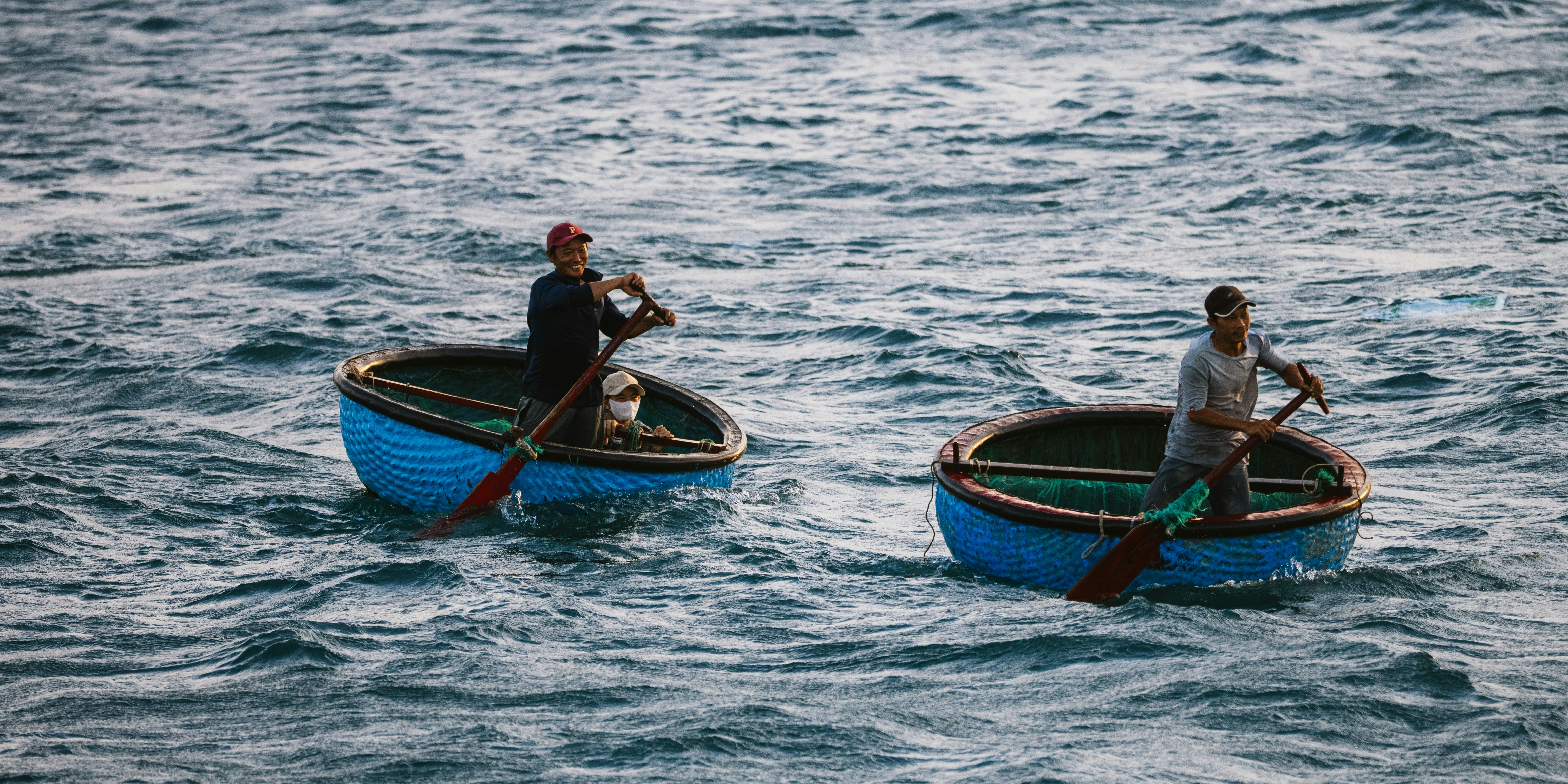 Two Blue Boats, One Shared Oar: A Coastal Rowing Moment