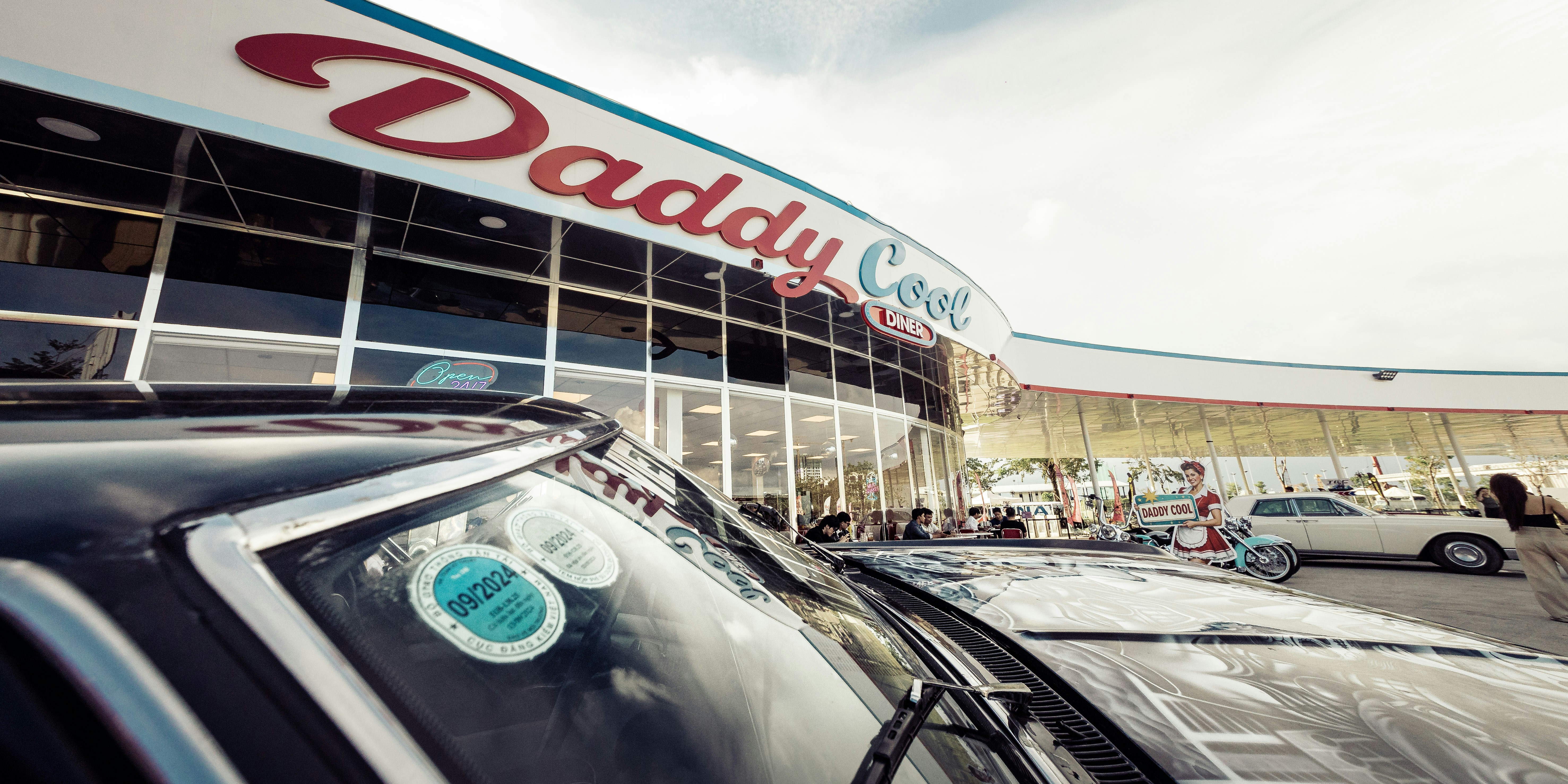 Neon Nostalgia: A Classic Car Show Lights Up the Daddy Cool Diner Lot