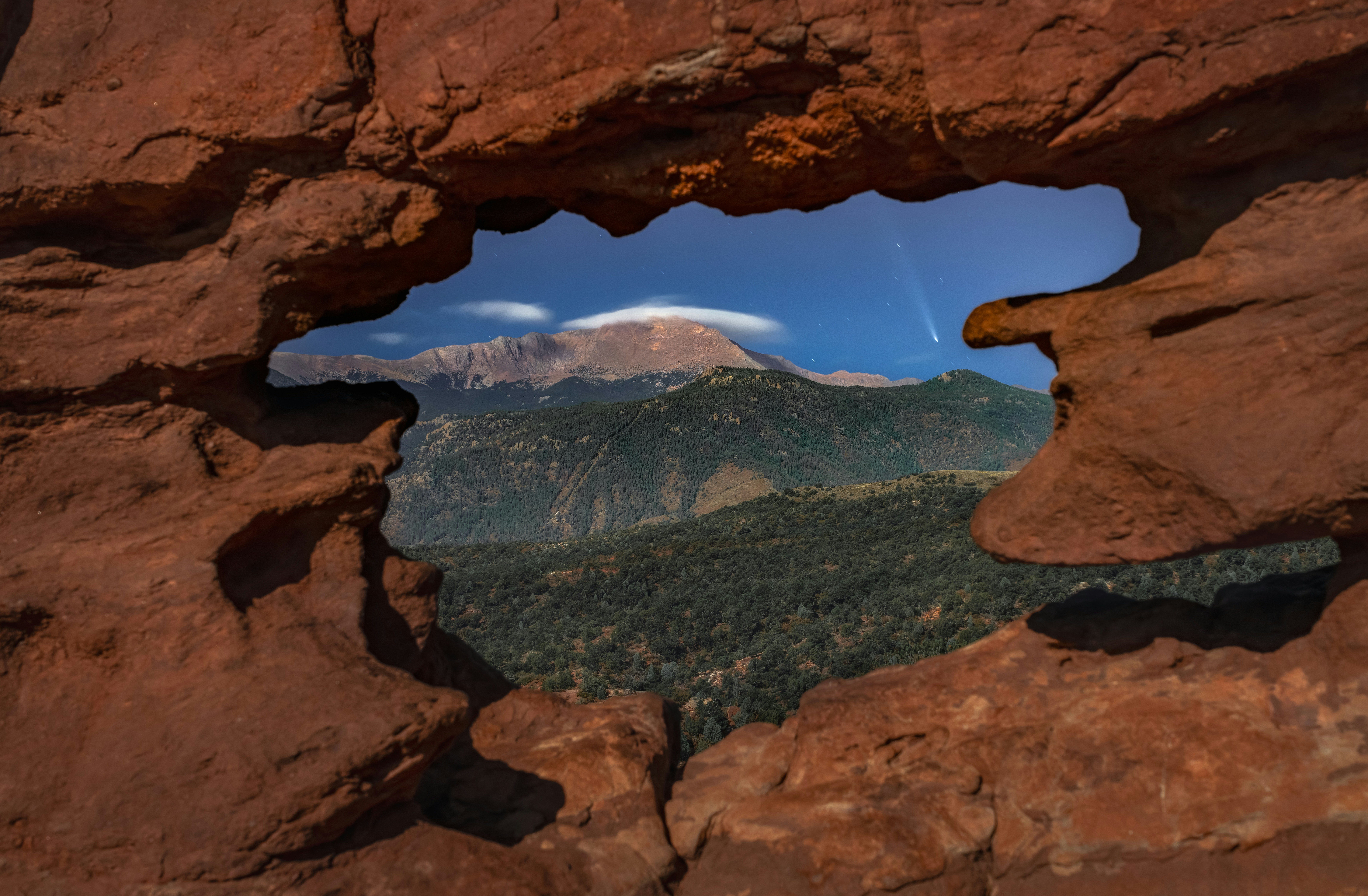 Red Canyon Window: Snow-capped Ridge Beyond a Desert Frame