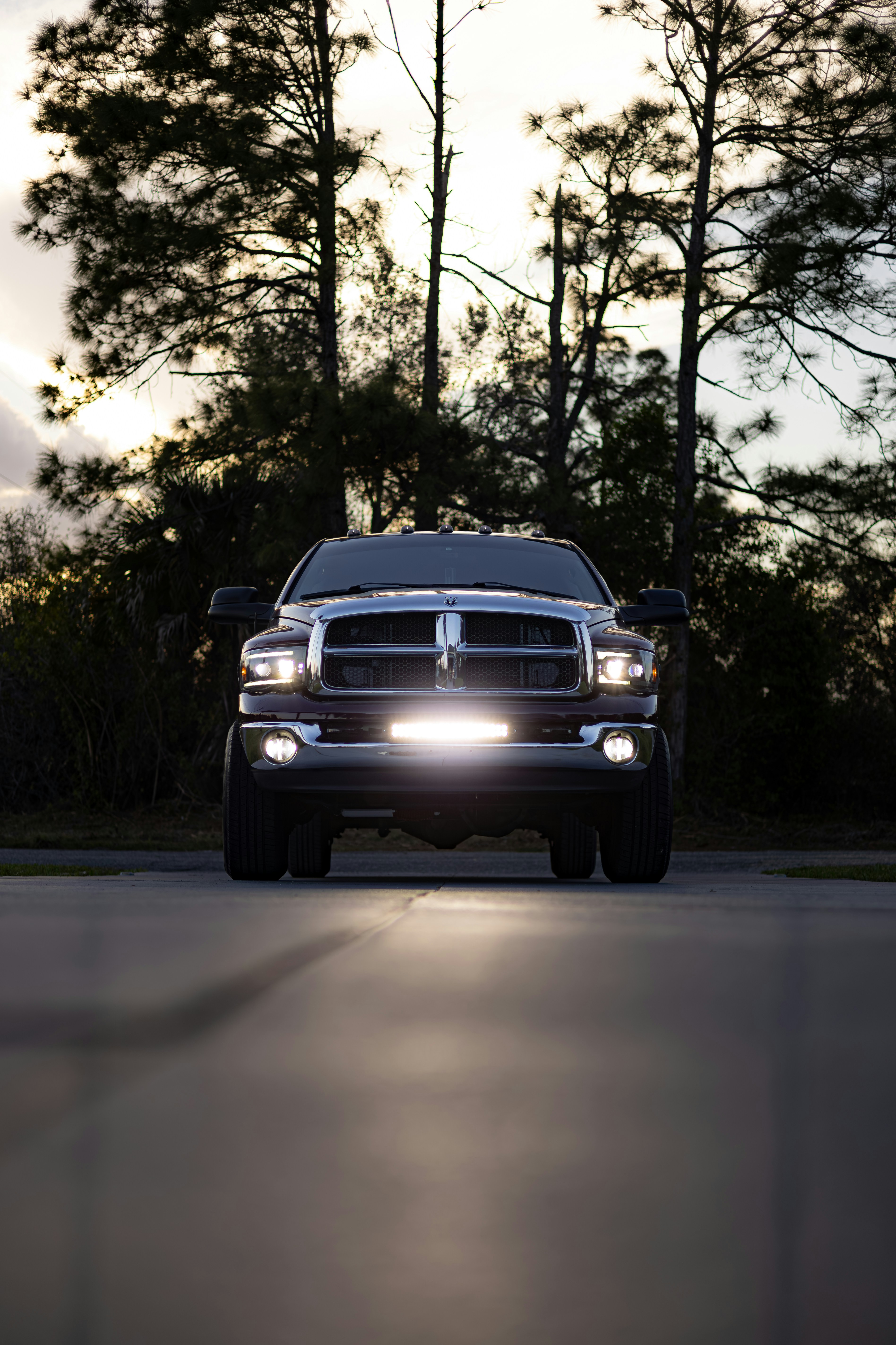 Front-and-center: a bold pickup stares down the road at dusk