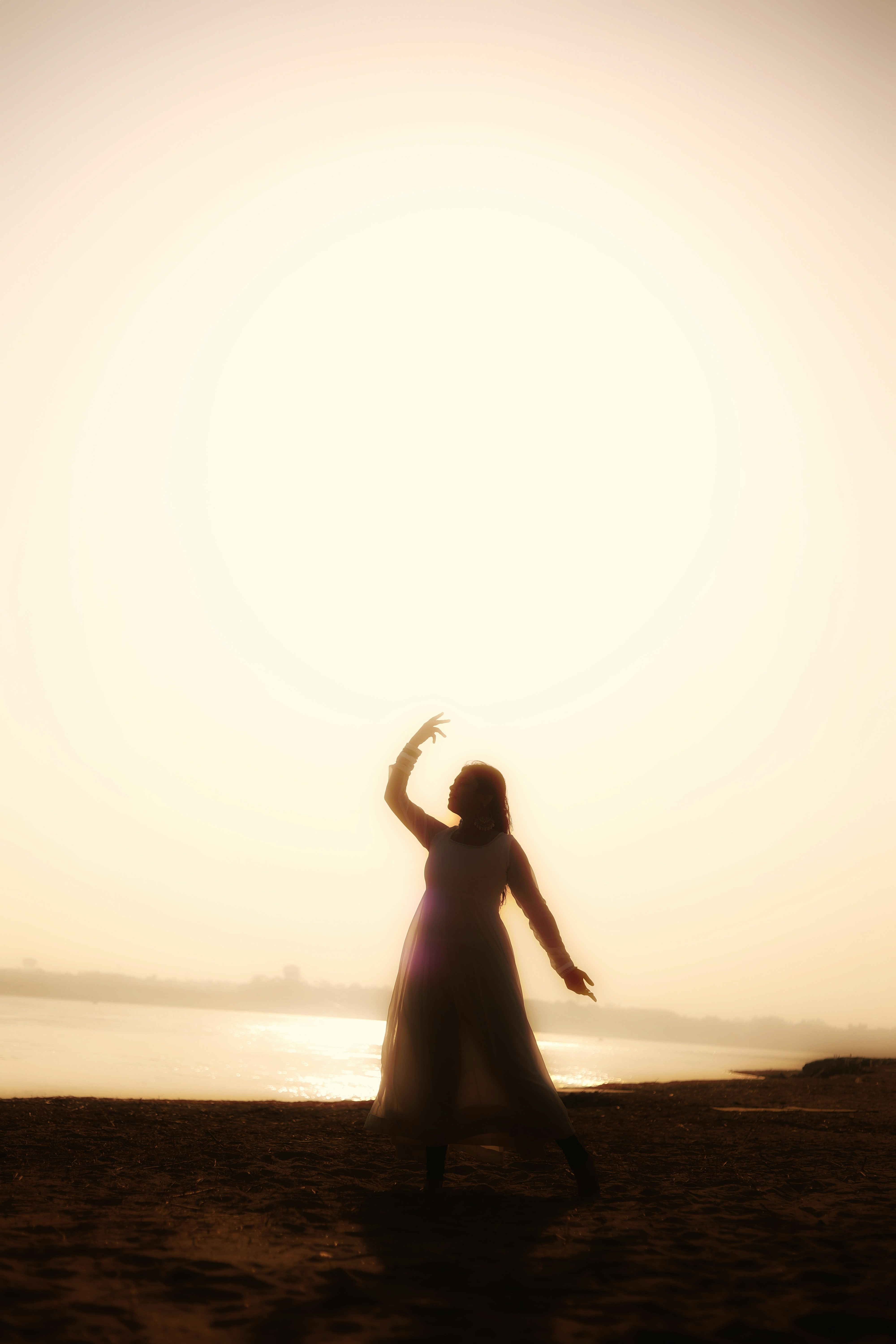 Silhouette in the Golden Hour: A Dancer at the Shore