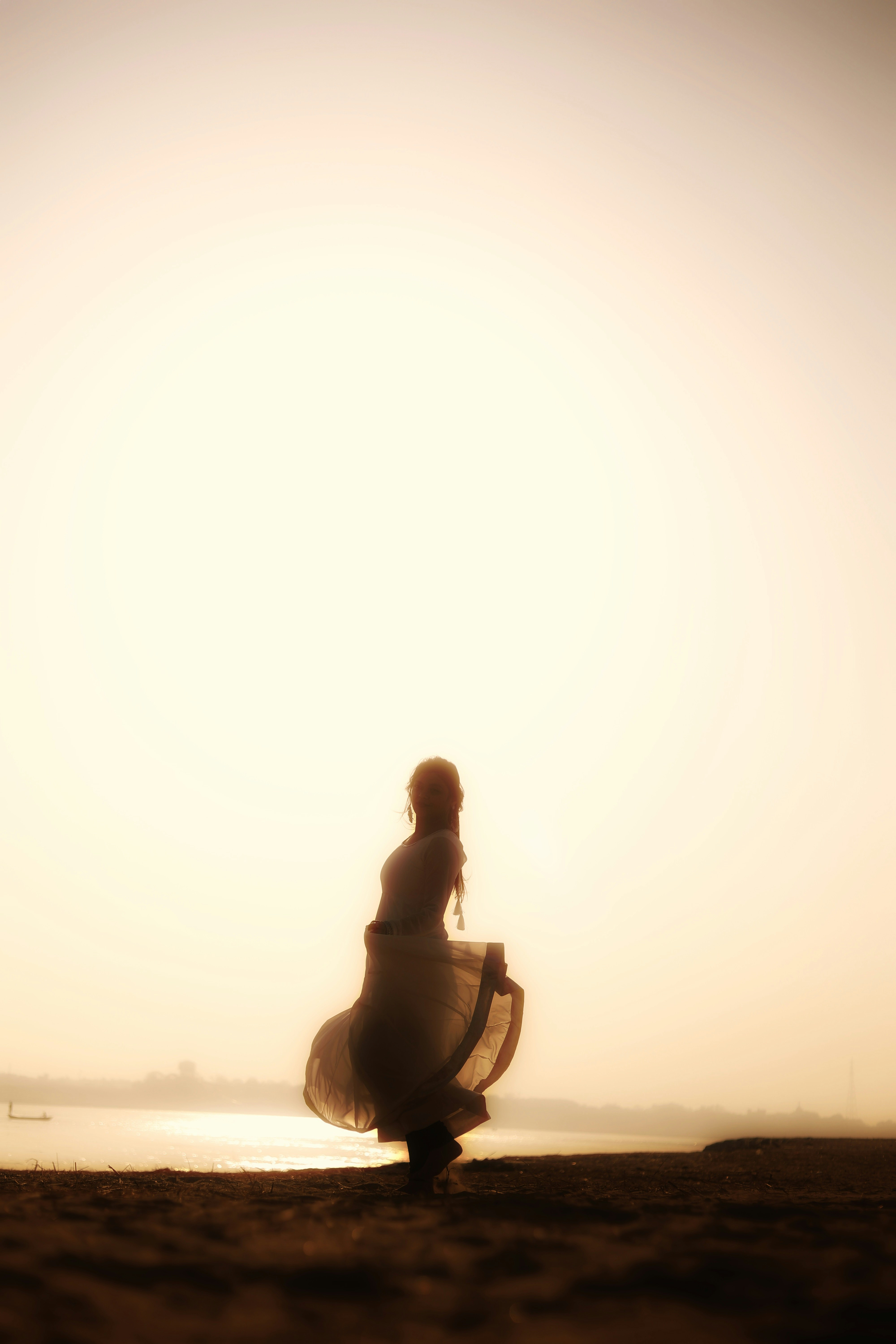Silhouette at Sunset: A Dancer on the Quiet Shore