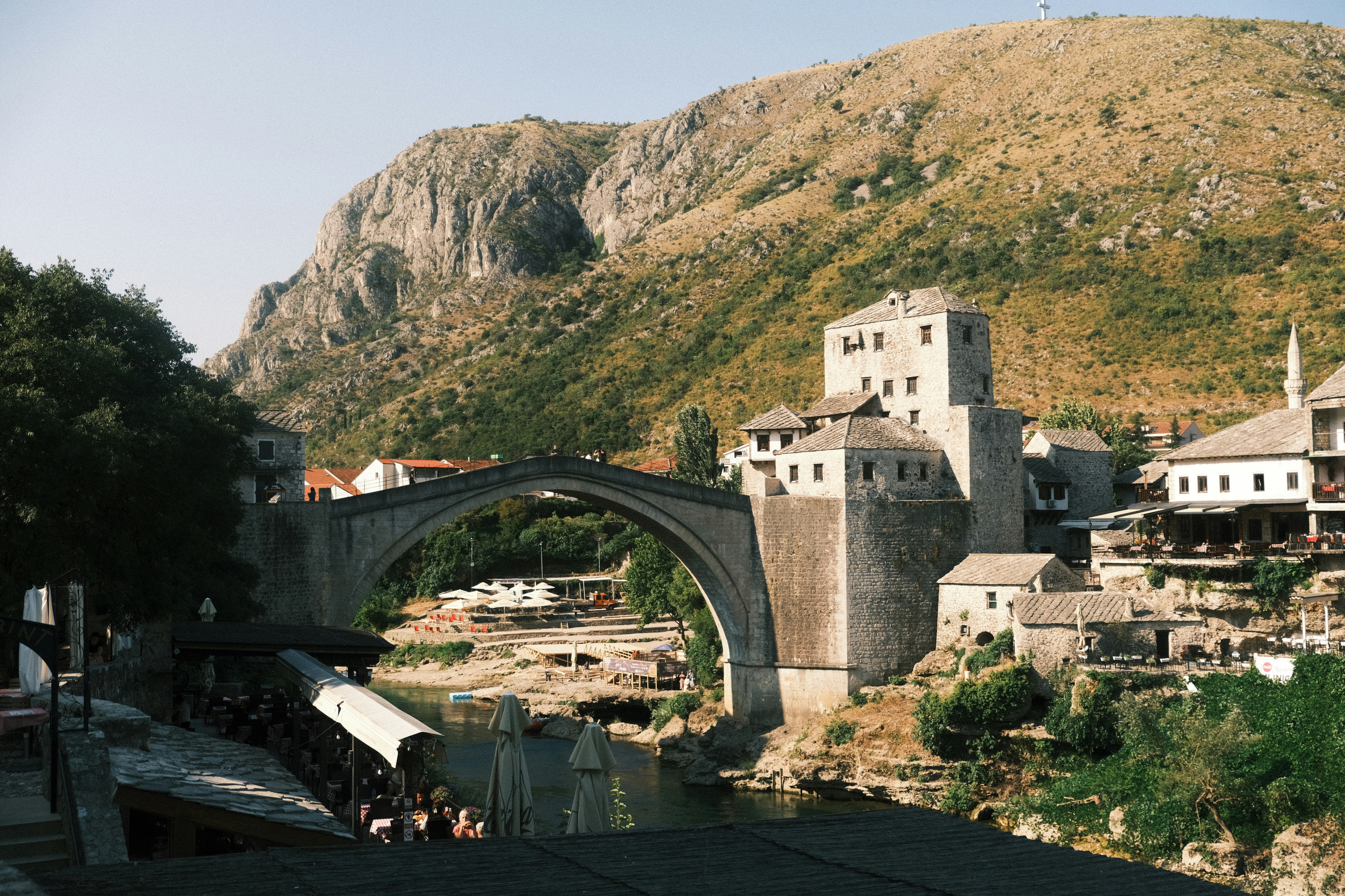 Stone Arch and Hillside Village Over the River