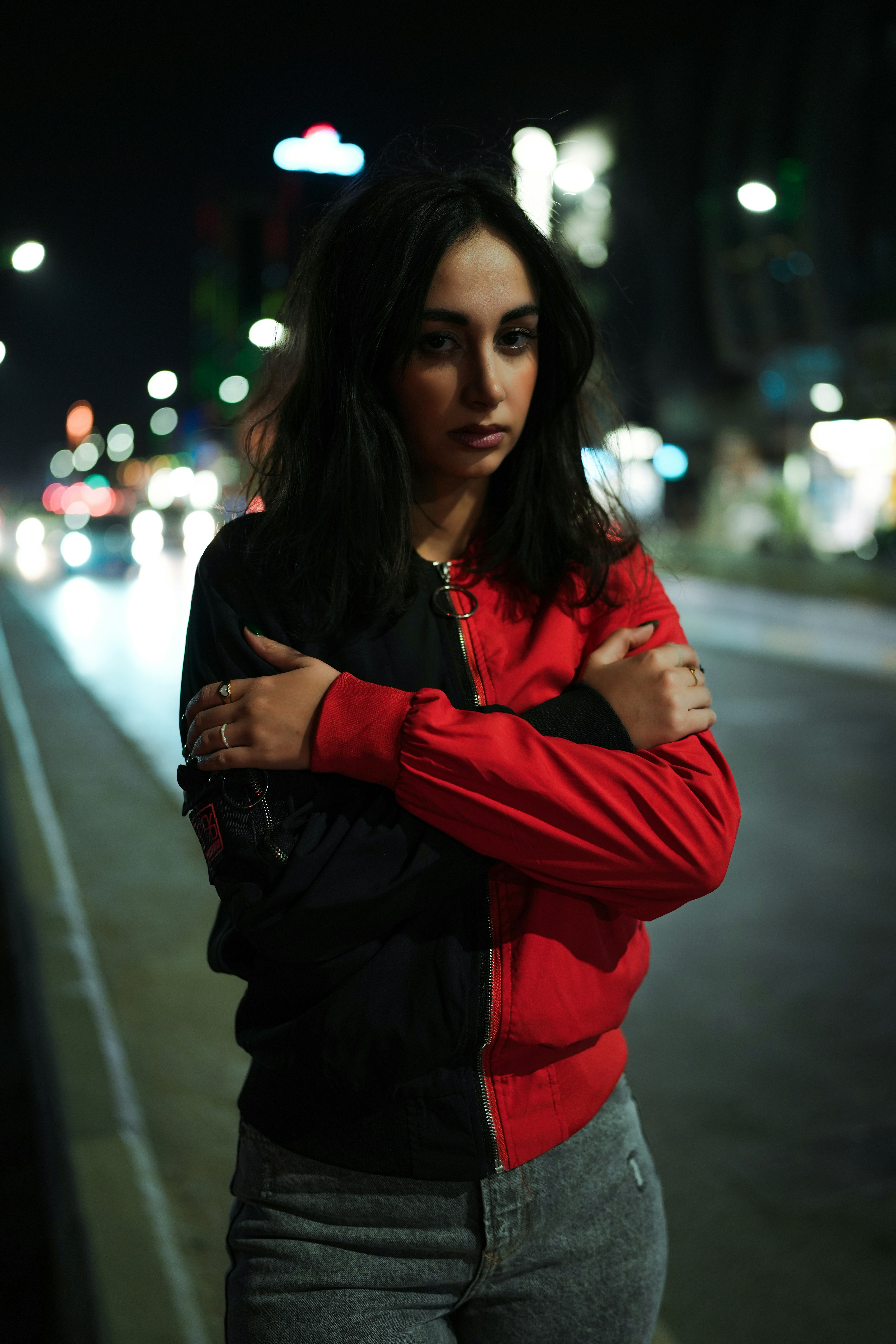 Night Street Portrait: A Self-Assured Gaze under Neon Bokeh