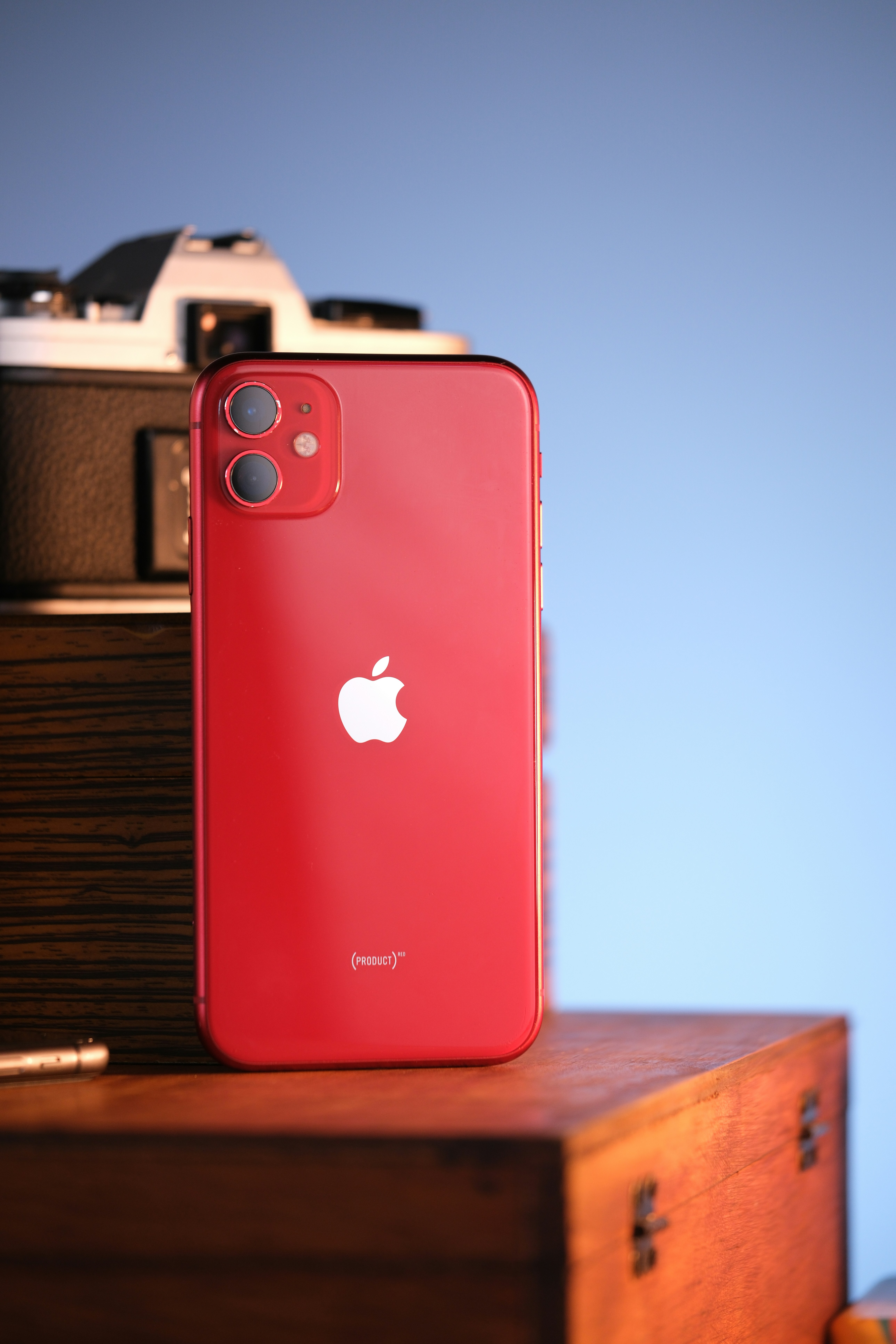 Crimson Studio: Red iPhone Propped Against Vintage Ladder