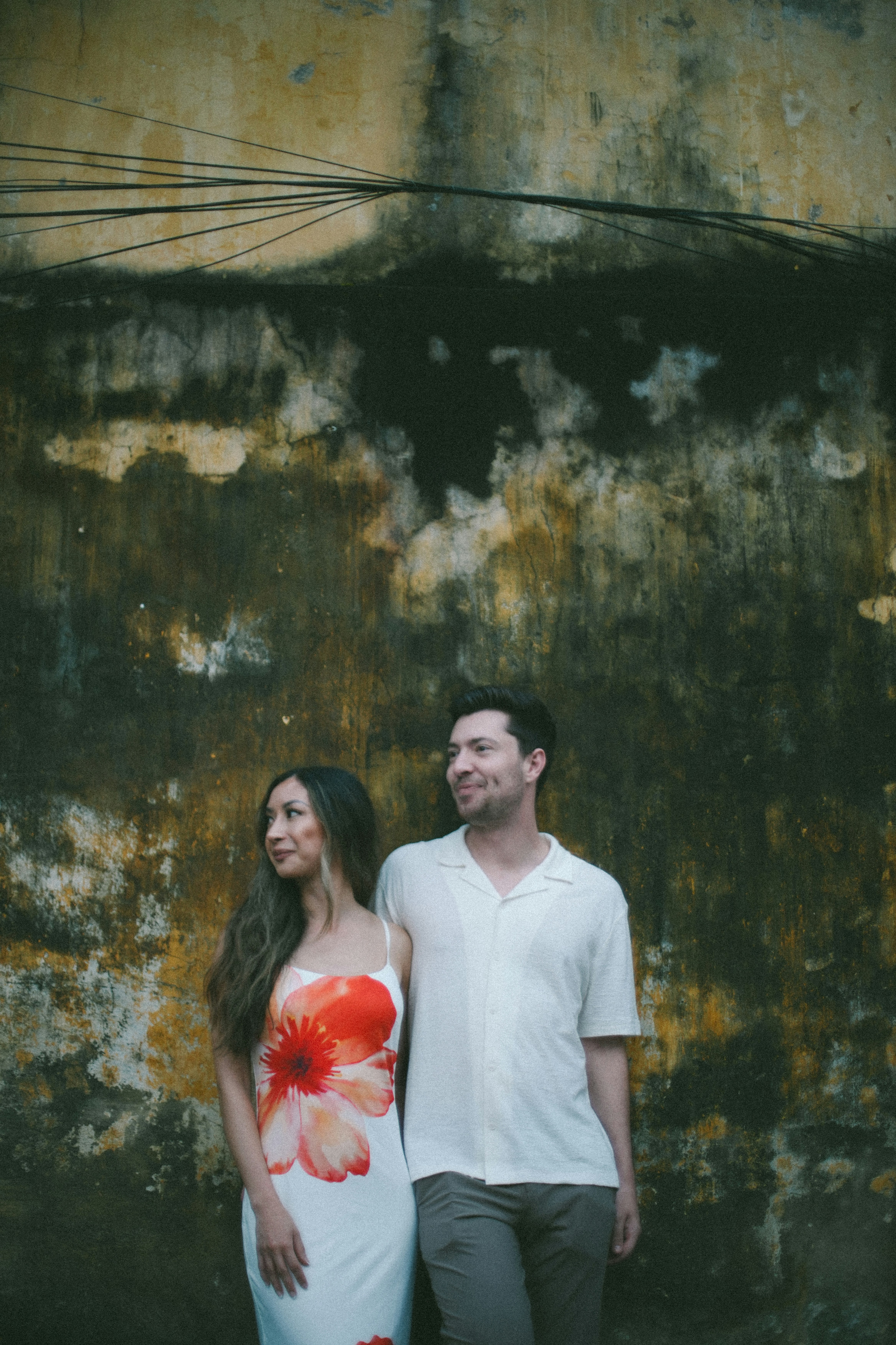 Rust and Romance: A Quiet Moment Against a Weathered Facade