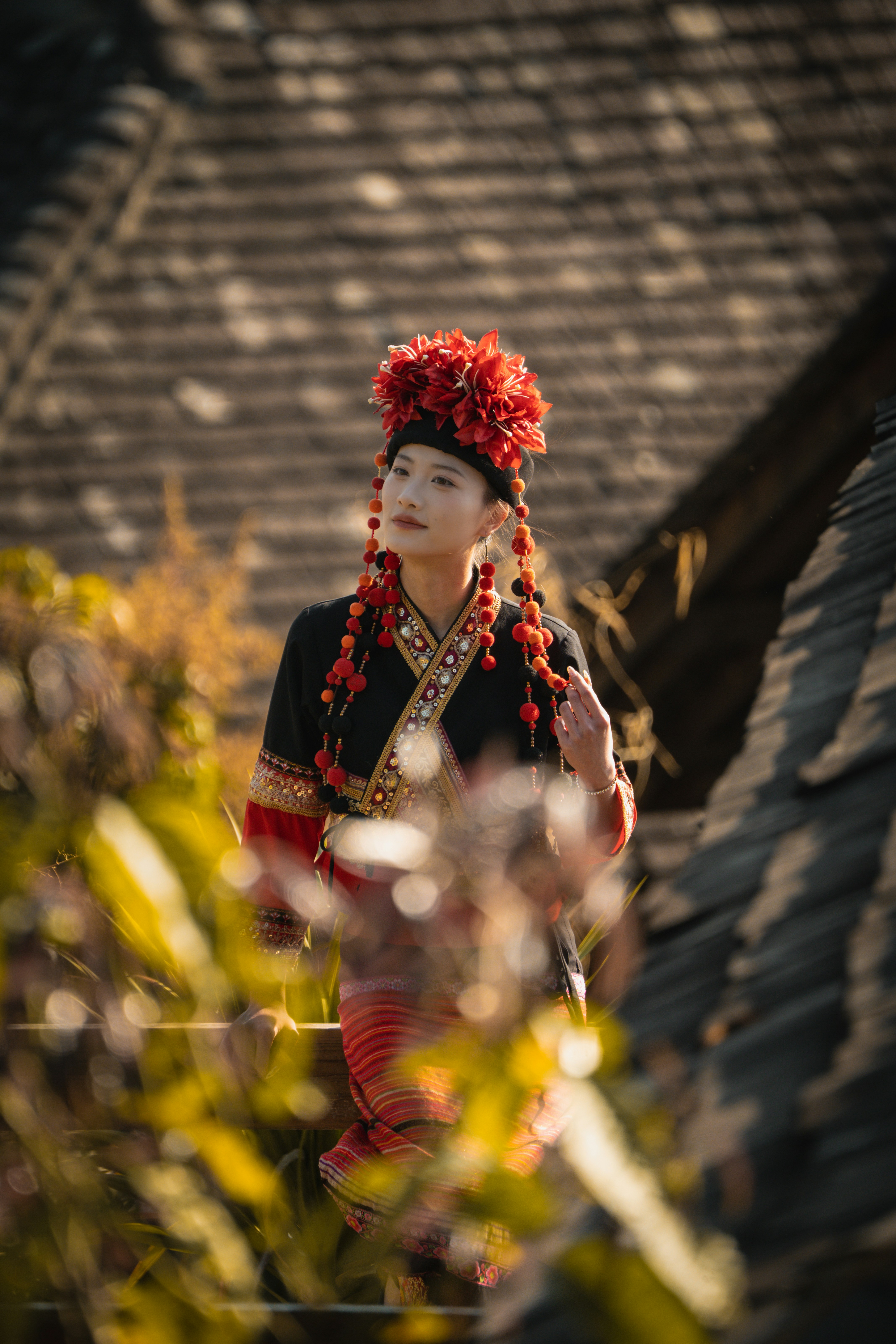 Portrait in Traditional Headdress Amid Autumn Rooftops