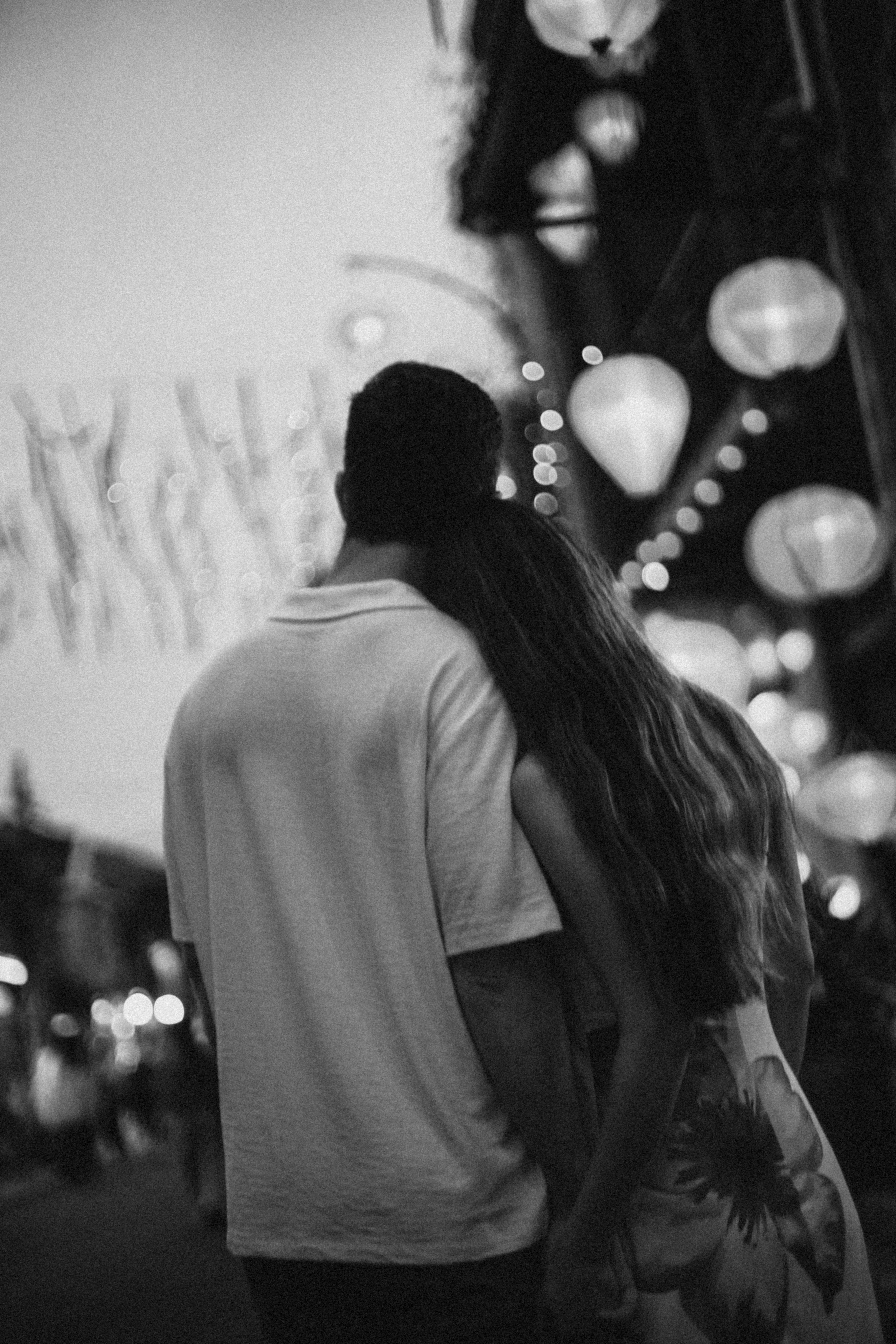 Night Street Embrace: A Quiet Moment Under Lantern Light