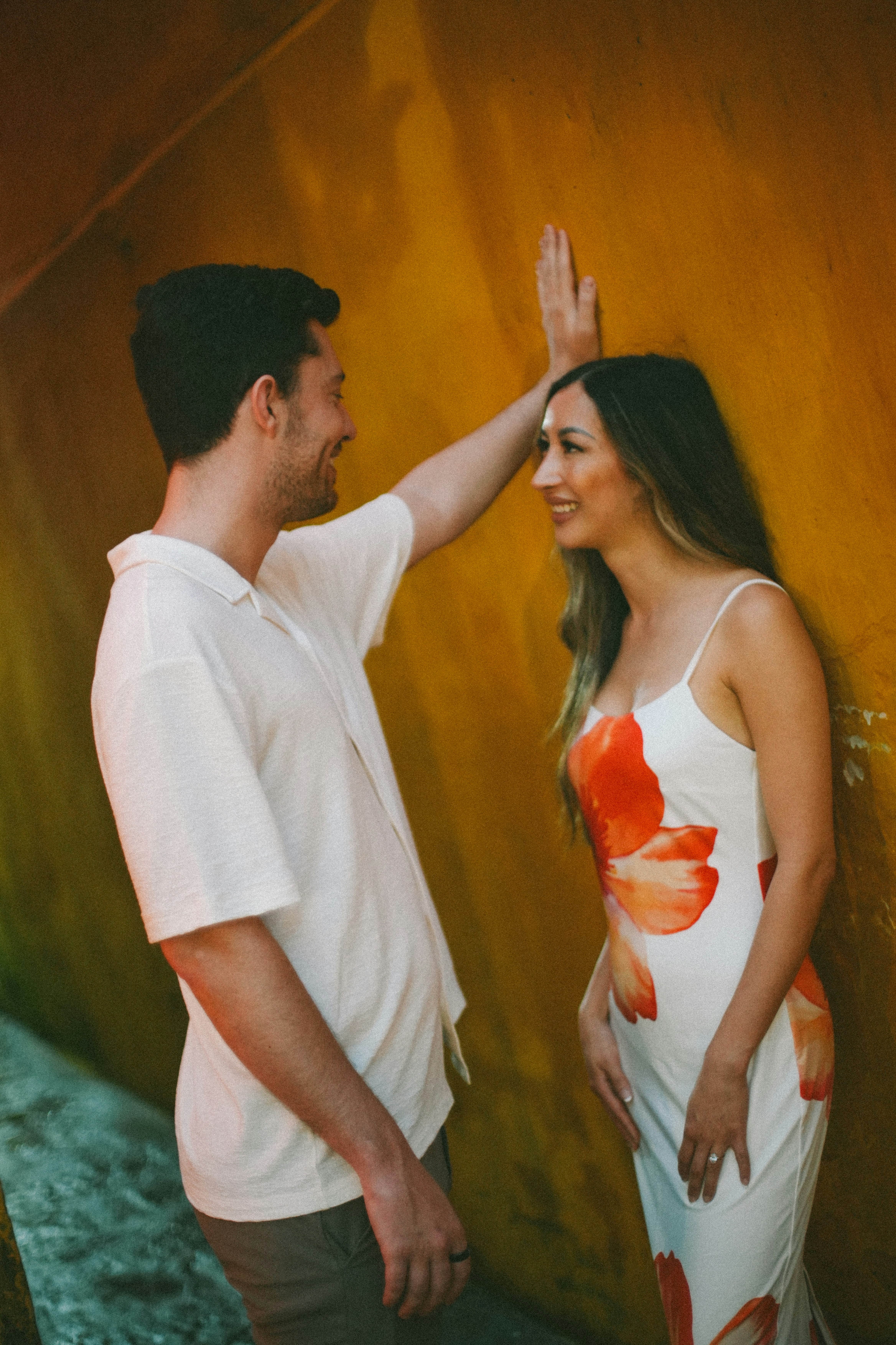 Warm Exchange by a Sunset Wall