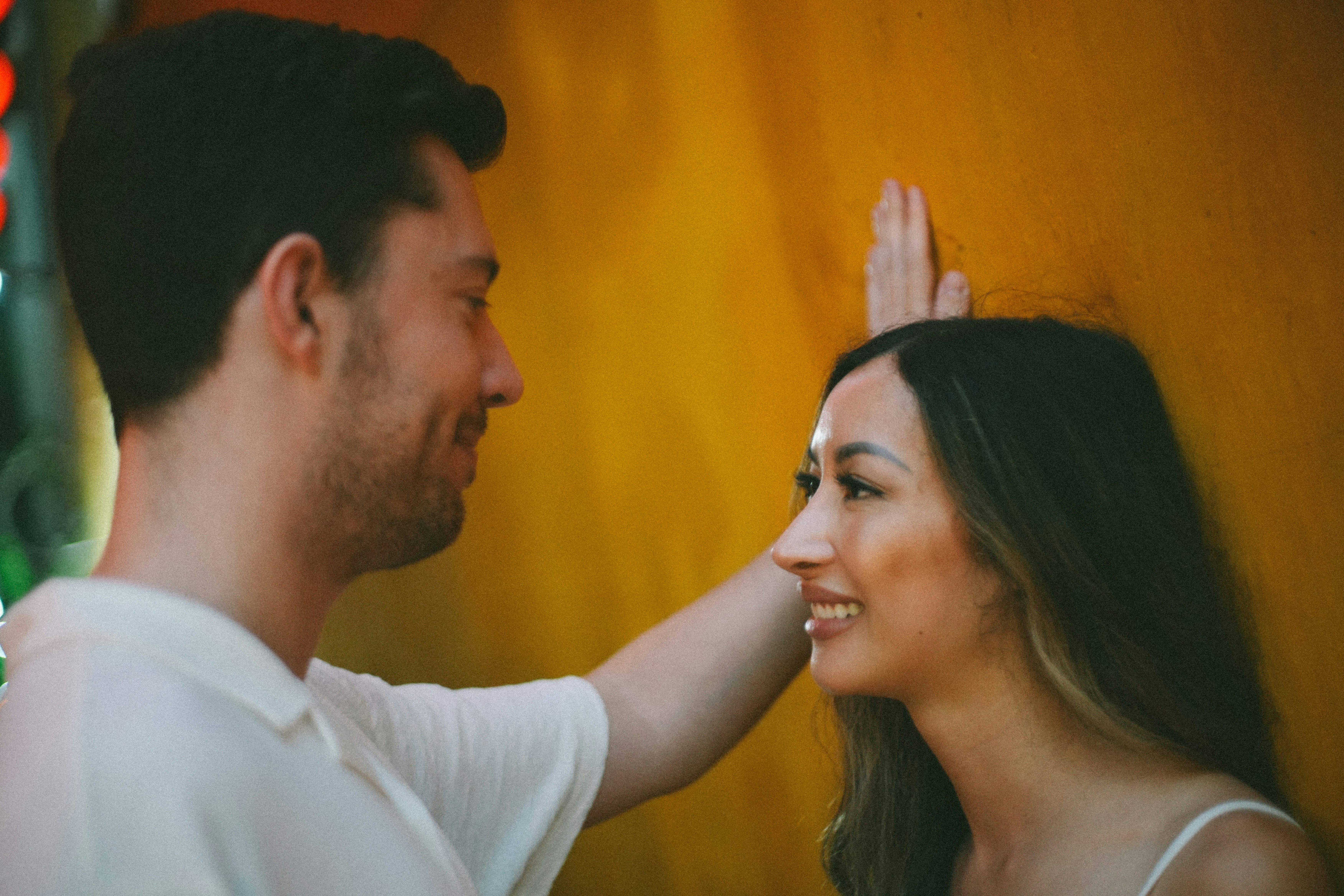 Warm Exchange: A Moment of Connection Against a Burnished Wall