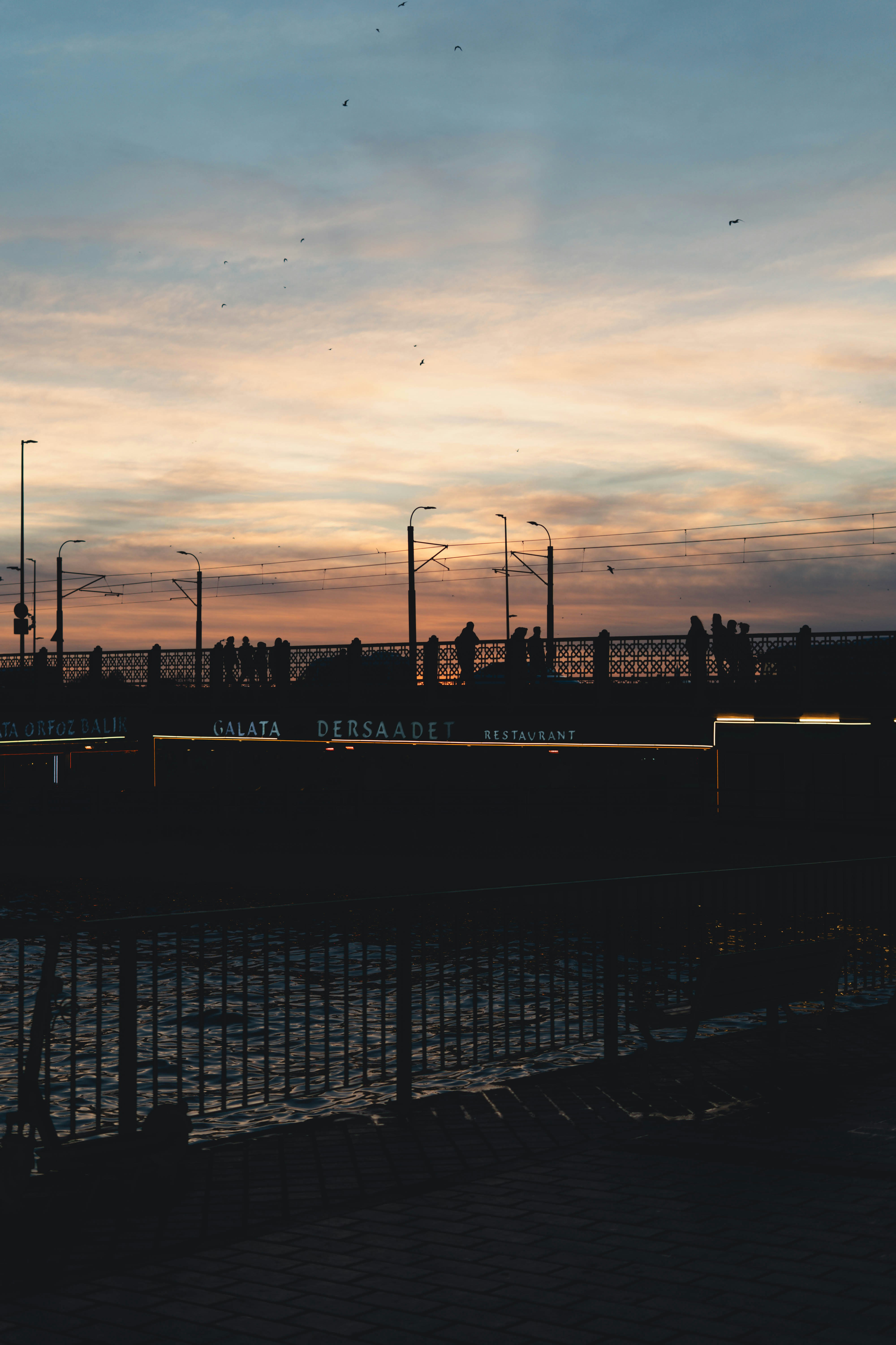 Silhouetted Skyline: A Sunset Walk Across the Pier