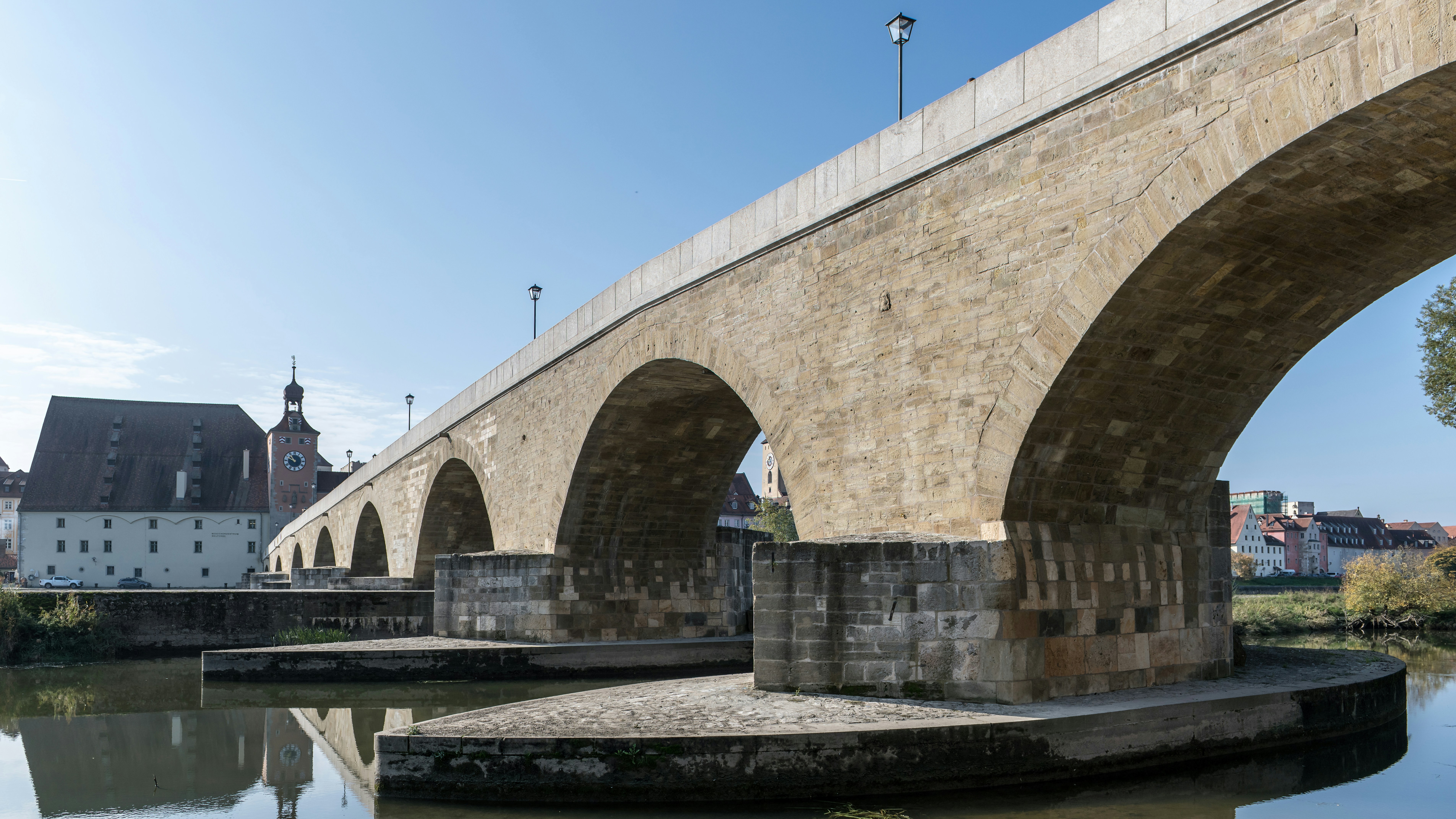 Arched Stone Bridge Reaching Over the Quiet River