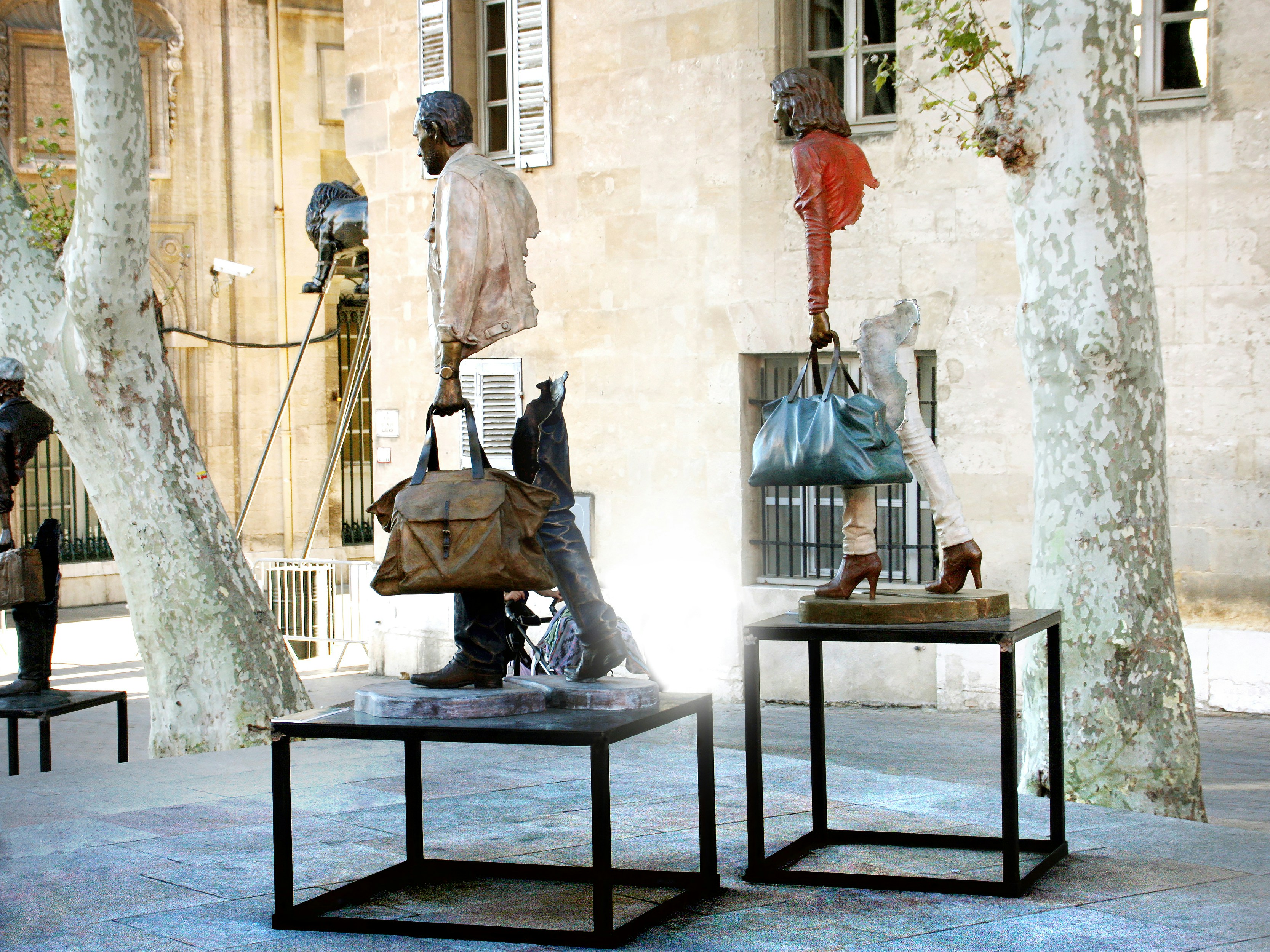 Urban Fashion on Stilts: Mannequin Figures on Concrete Pedestals