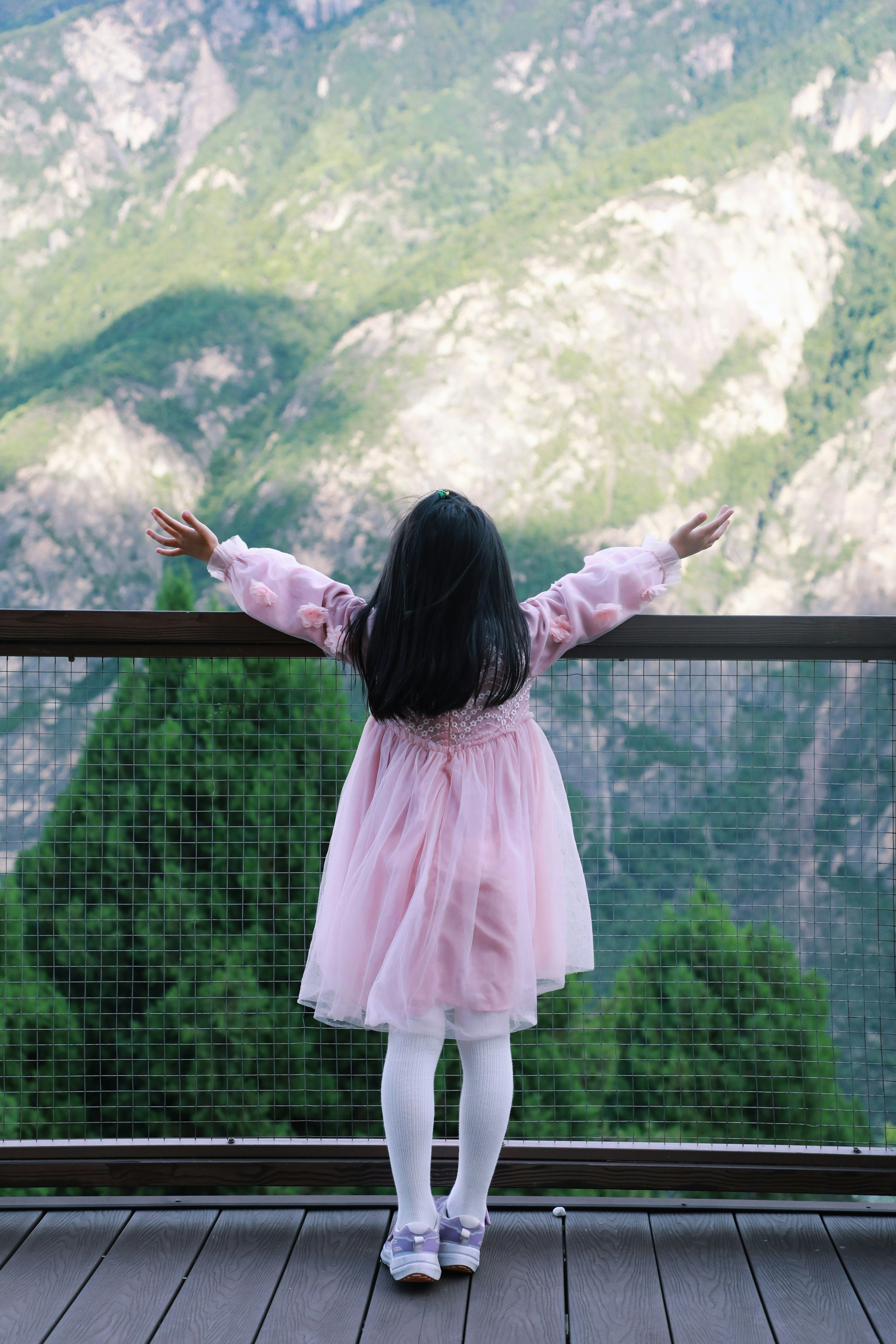 Open-Arm Moment on a Scenic Balcony