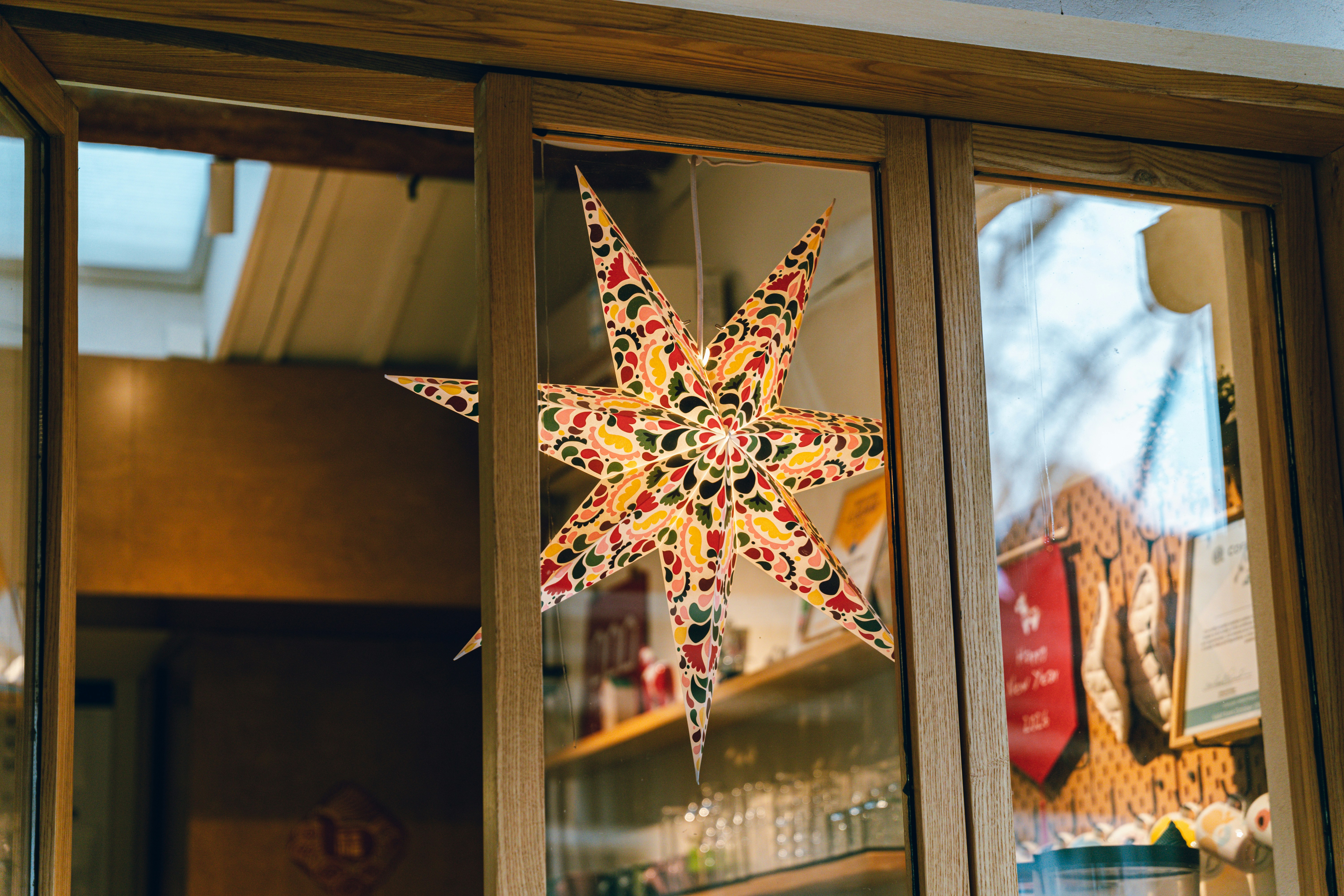Star of Light: a festive star suspended in a storefront window