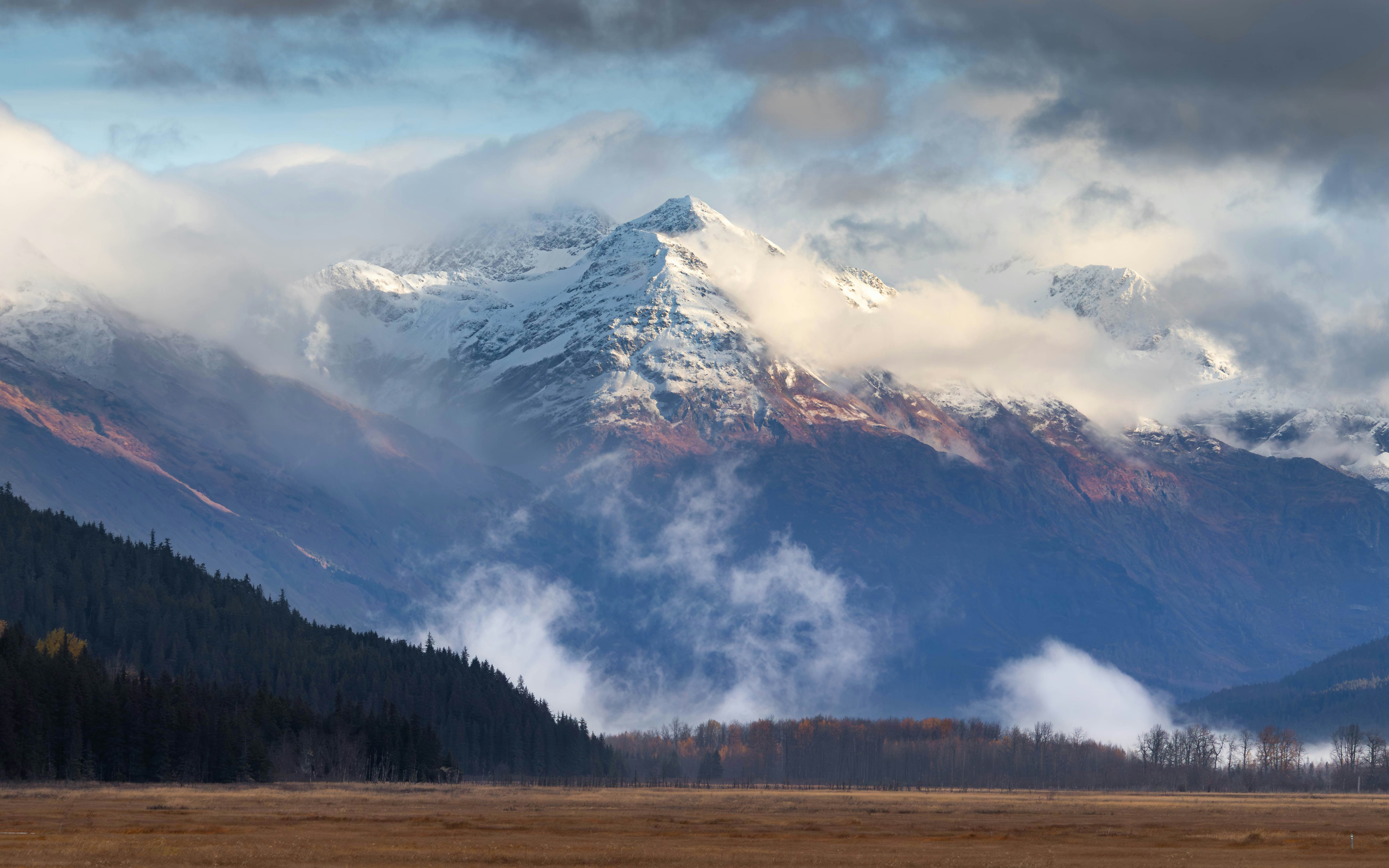 Mist-claimed Peaks Over a Quiet Valley