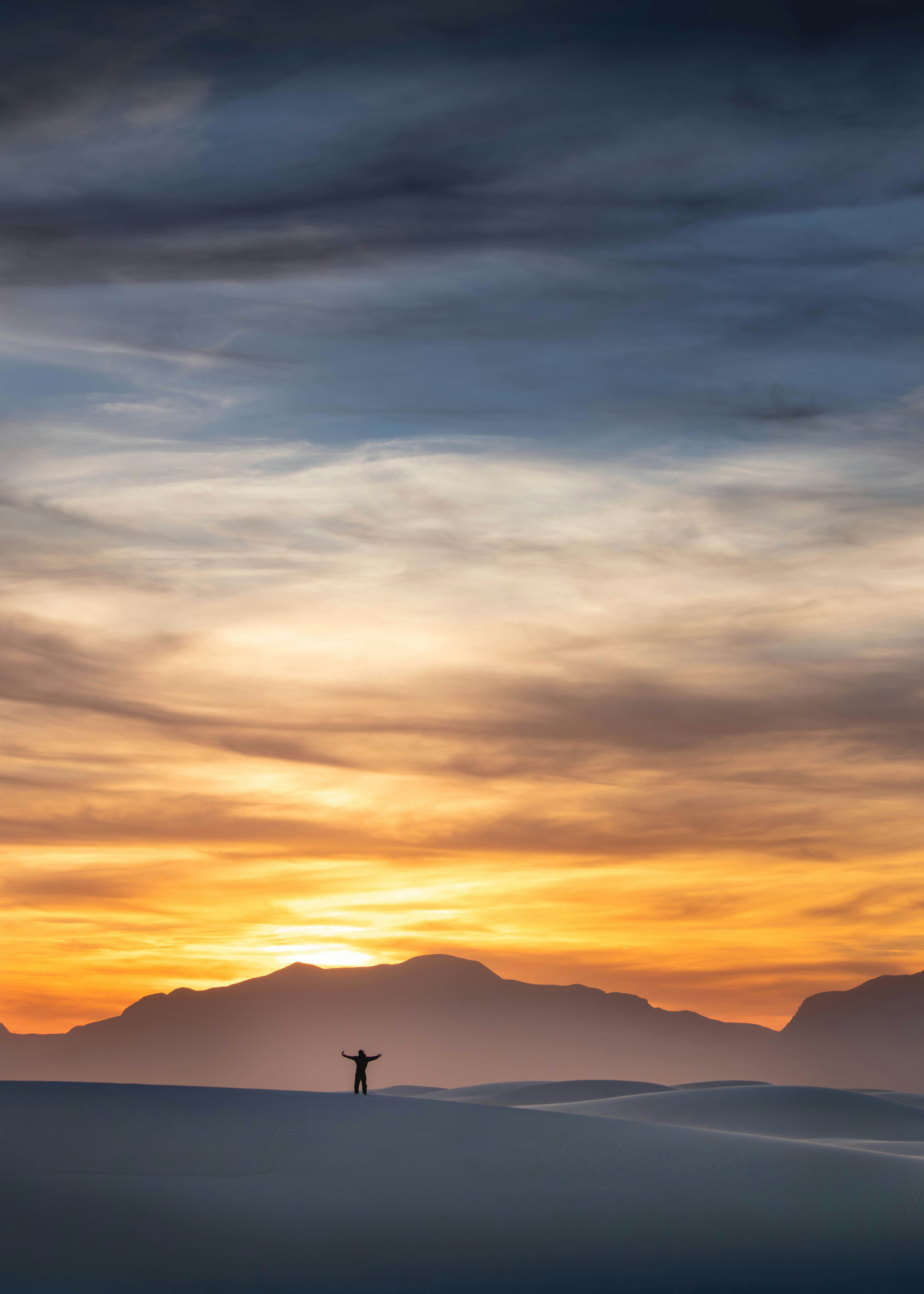 Silhouette at Sunrise Over Dunes