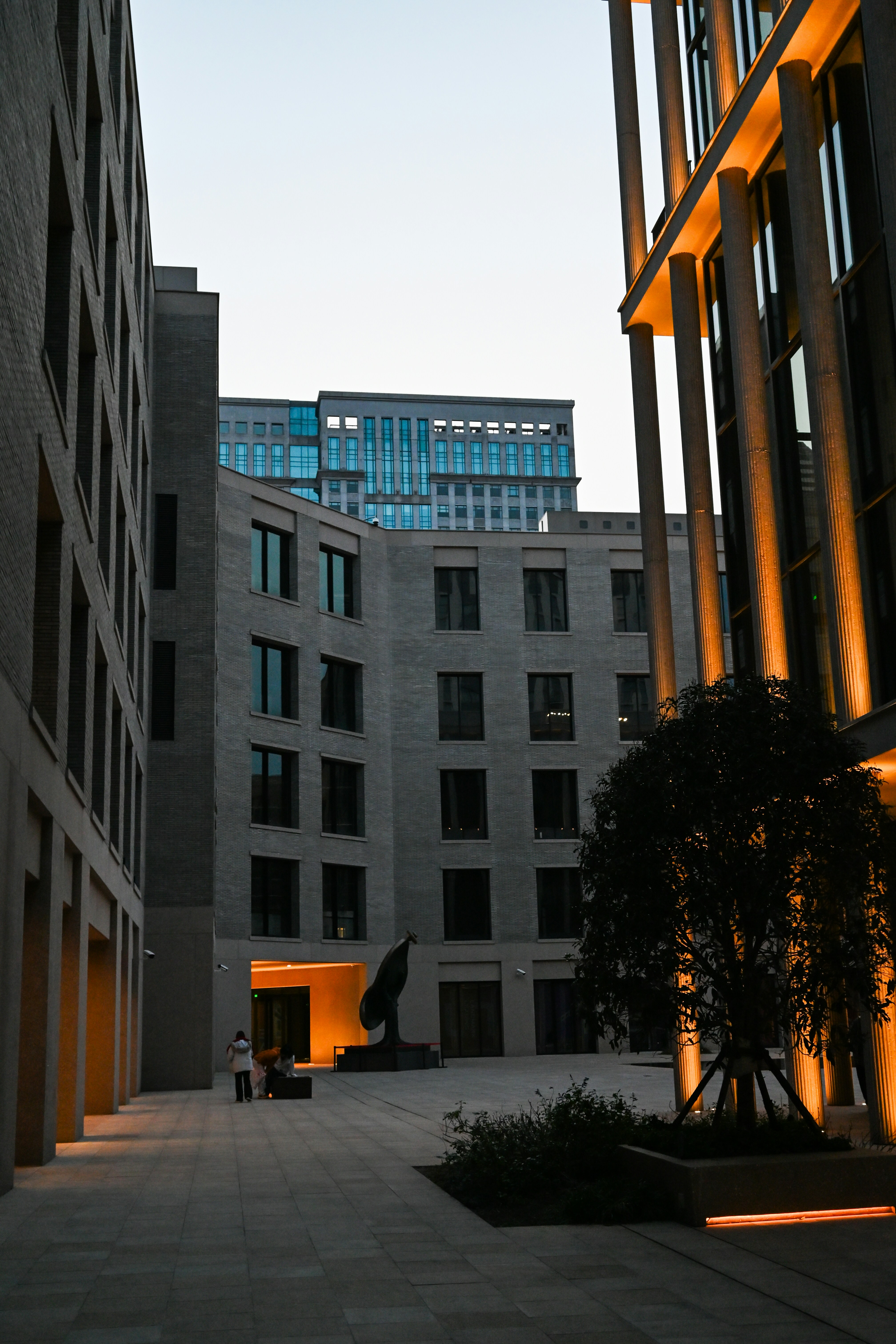 Cobalt Sky Over a Quiet Courtyard Between Modern Facades