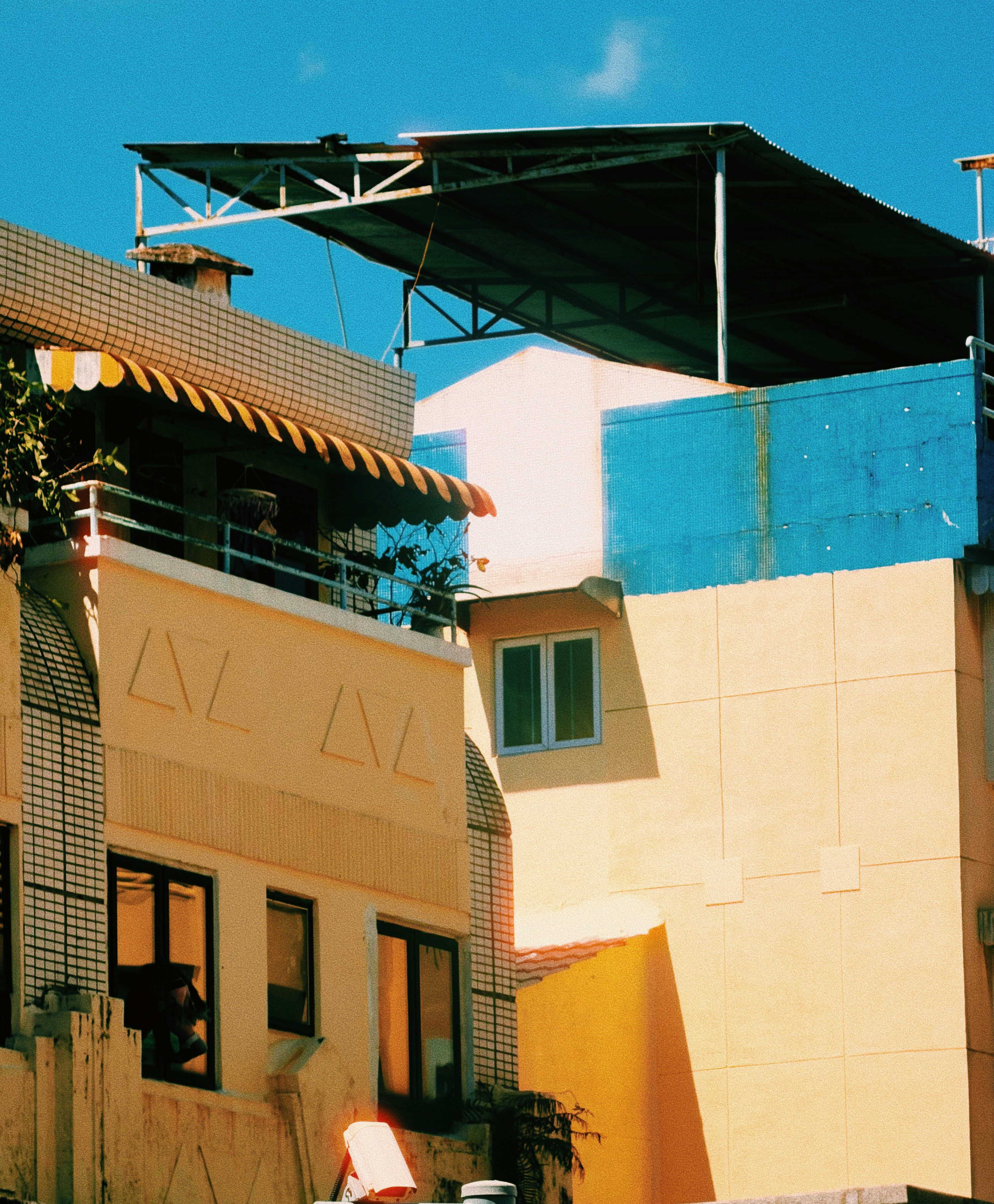 Sunlit Terrace Over Urban Facade