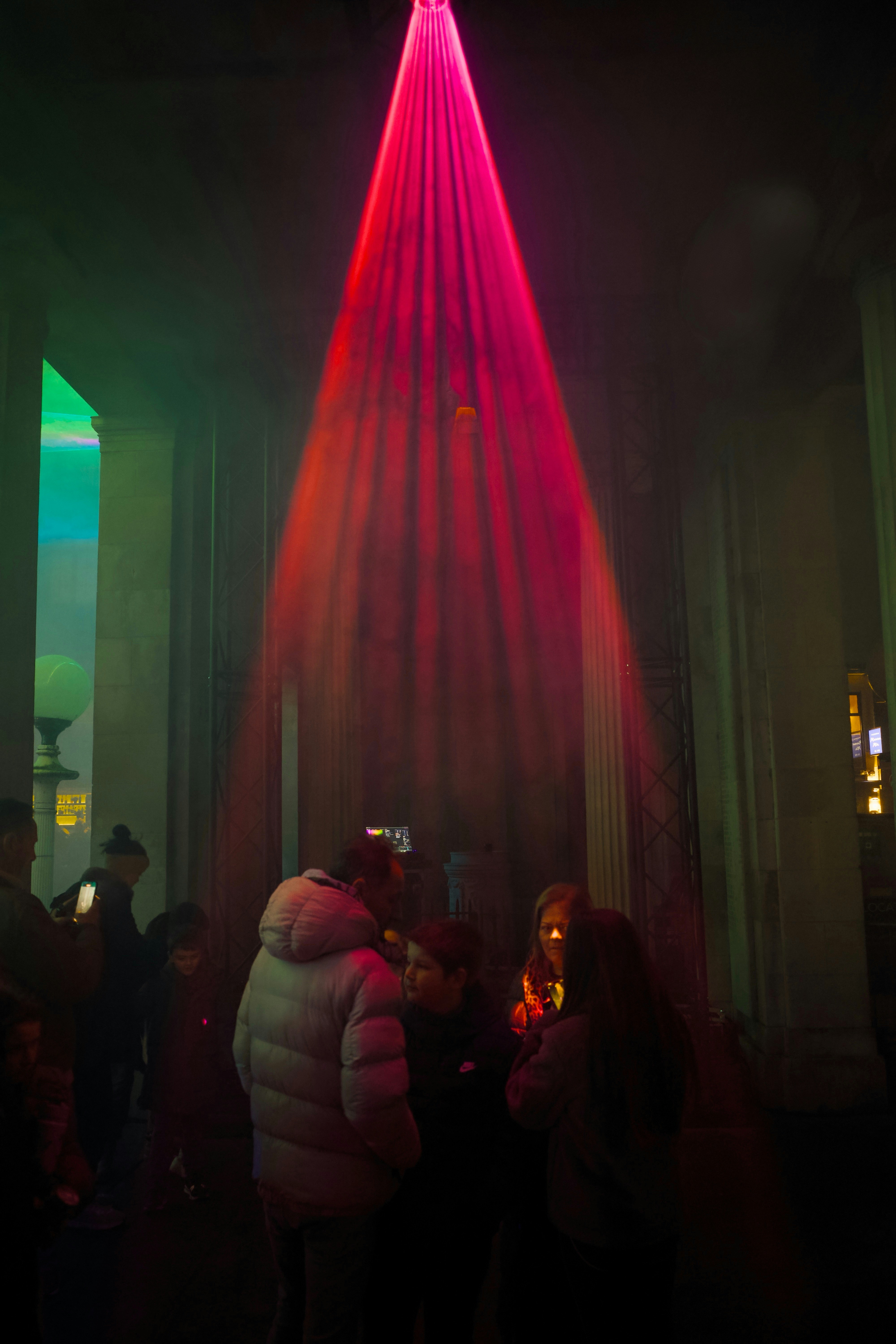 Neon beam in the cathedral haze: a night under color