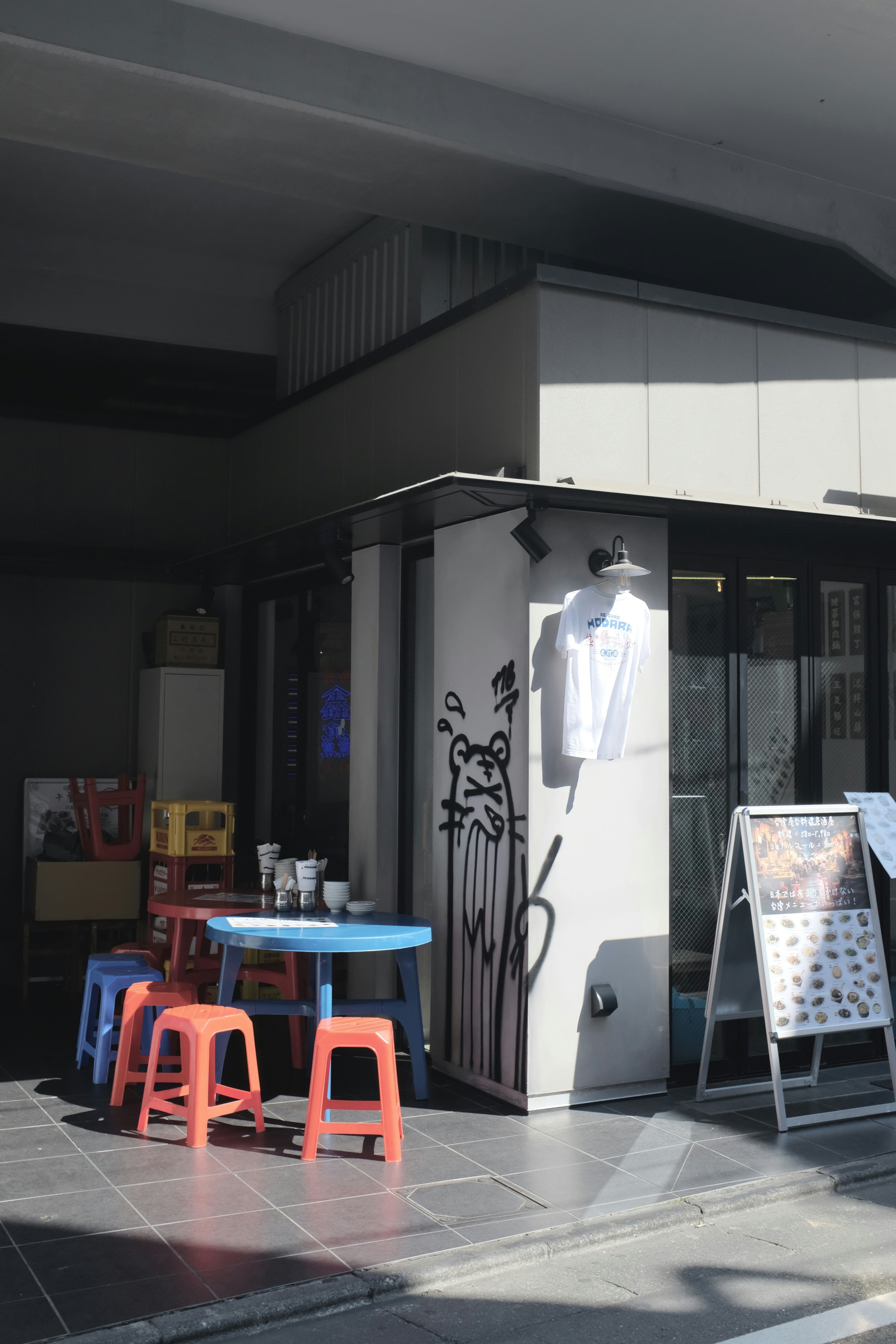 Cafe Scene with Colorful Stools and Graffiti Architecture