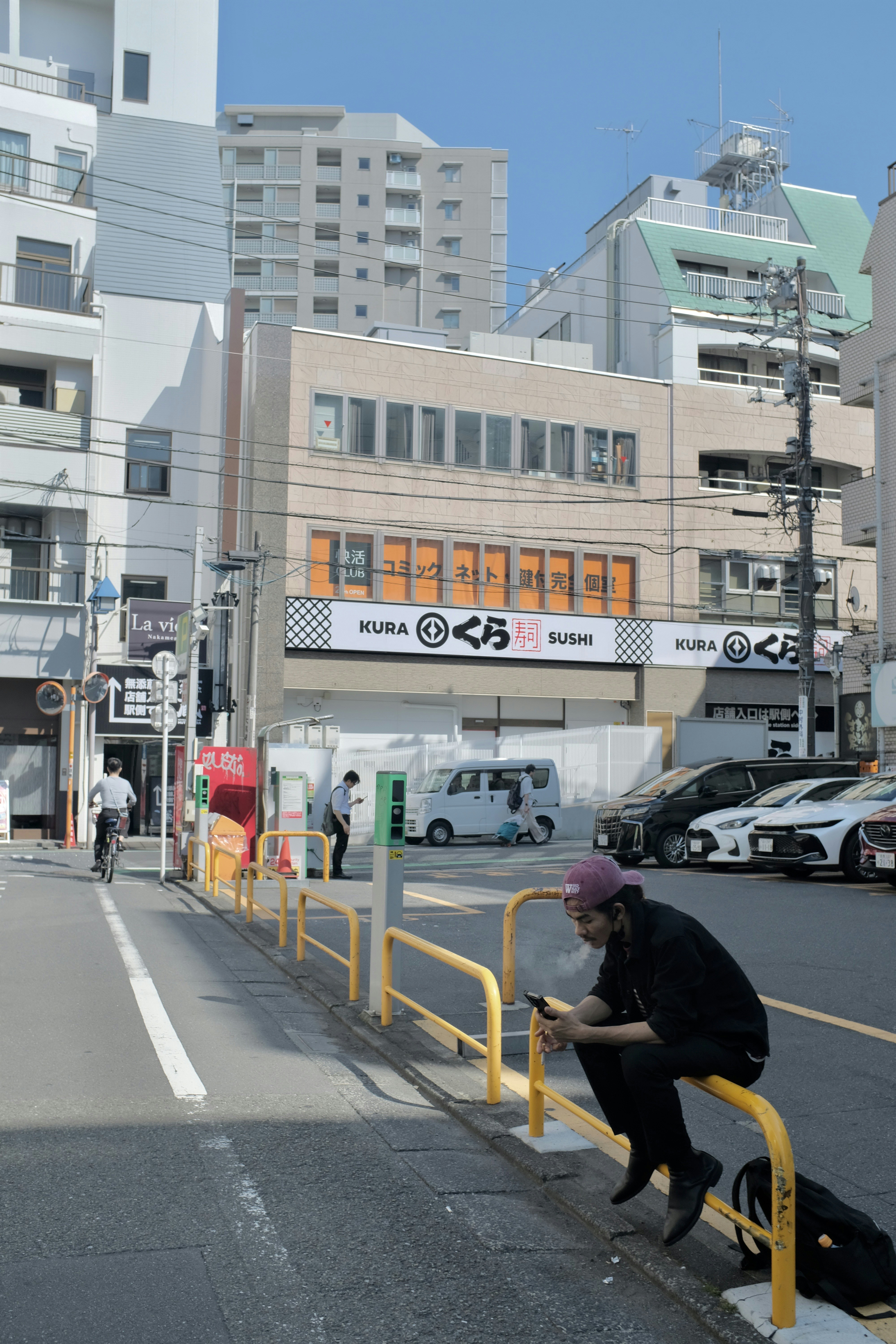 Streetlife Pause: A Quiet Moment by the Sushi Shop