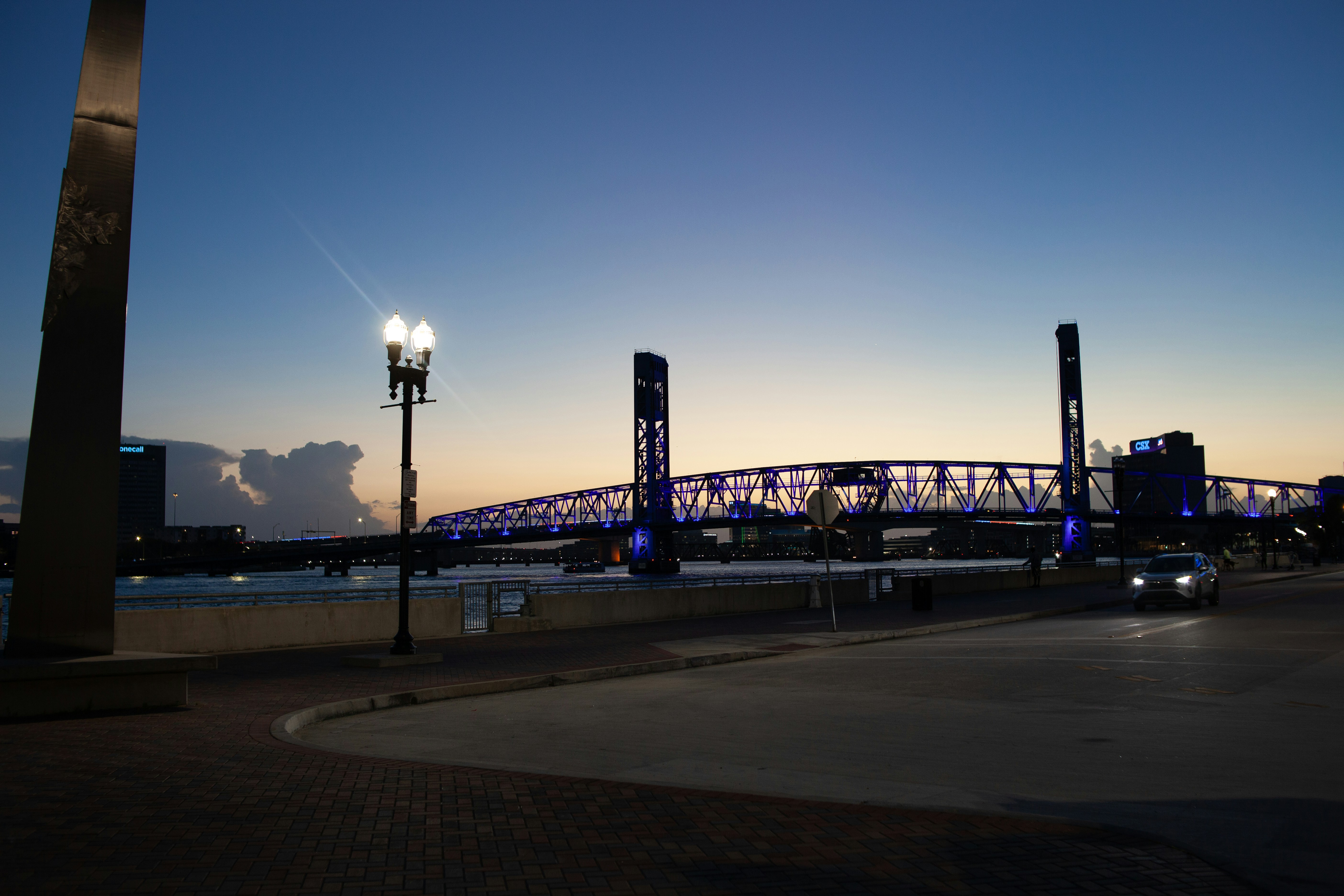 Luminous Drawbridge at Dusk: Blue Illumination Over the Riverfront