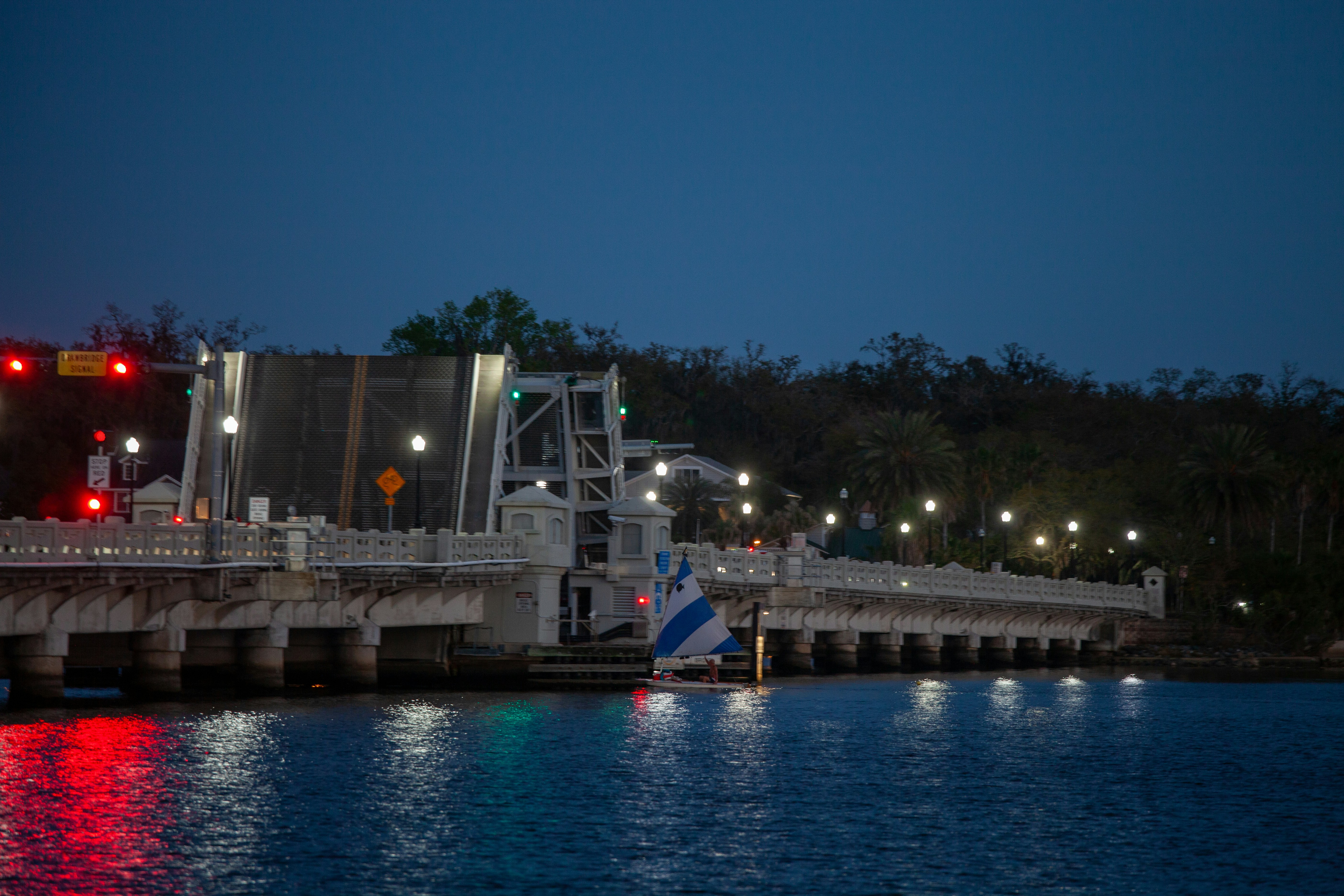 Hydro-Launch at Dusk: A Quiet Sail beside the Waterway Bridge