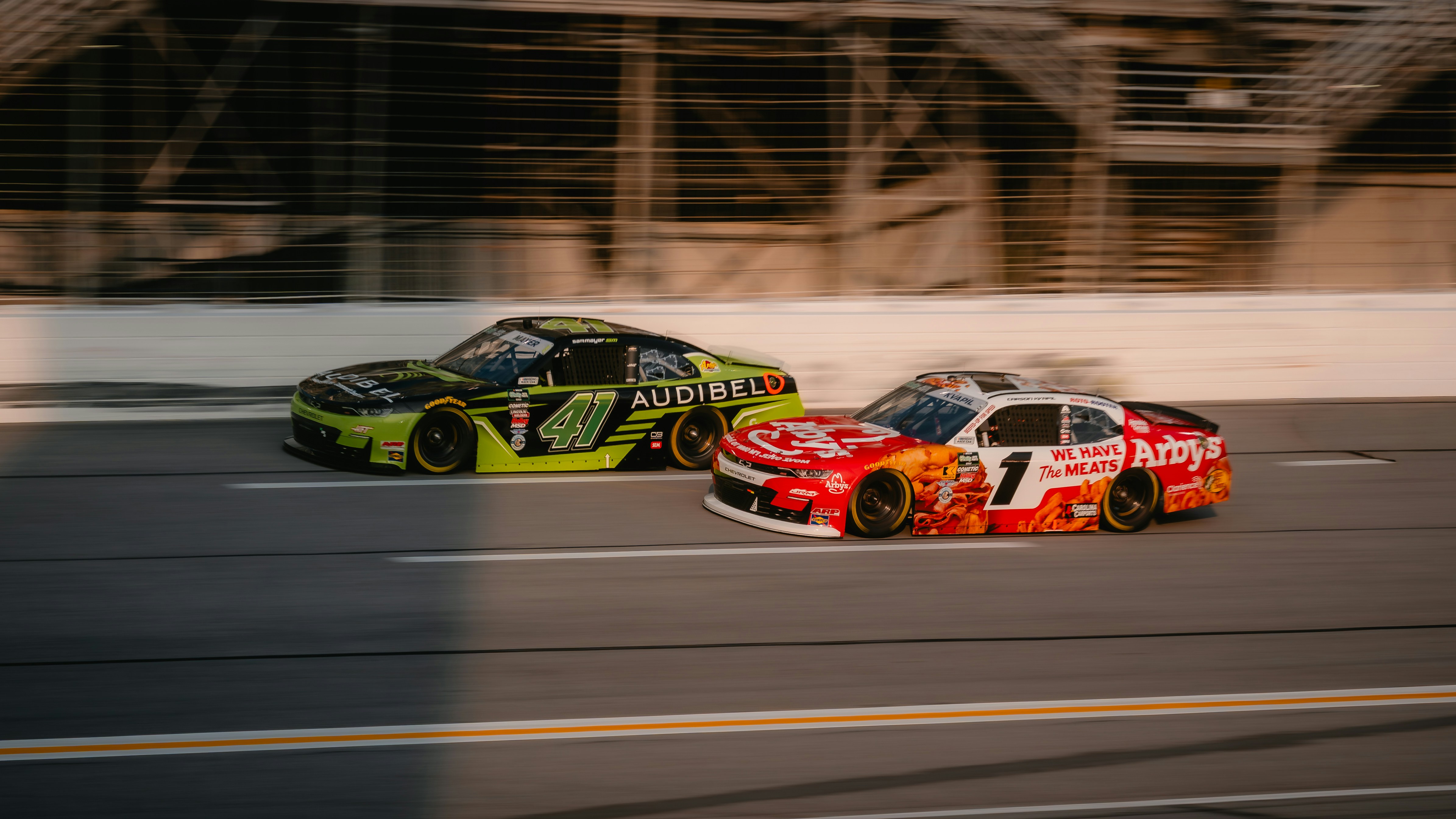 Rivals in Motion: Neon-green and Flame-red Sprint for Position