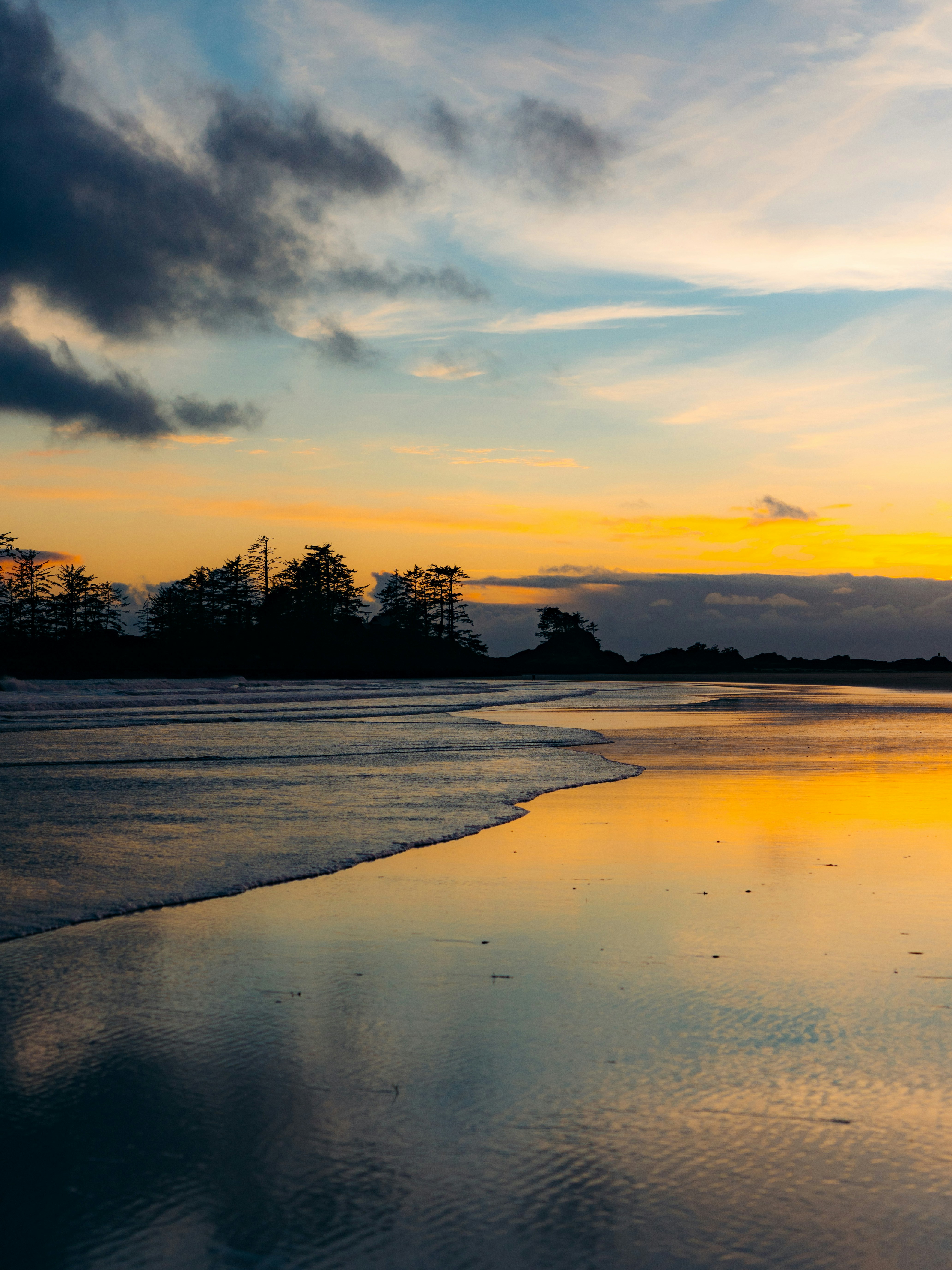 Sunset Silhouette Over Tidal Shoreline