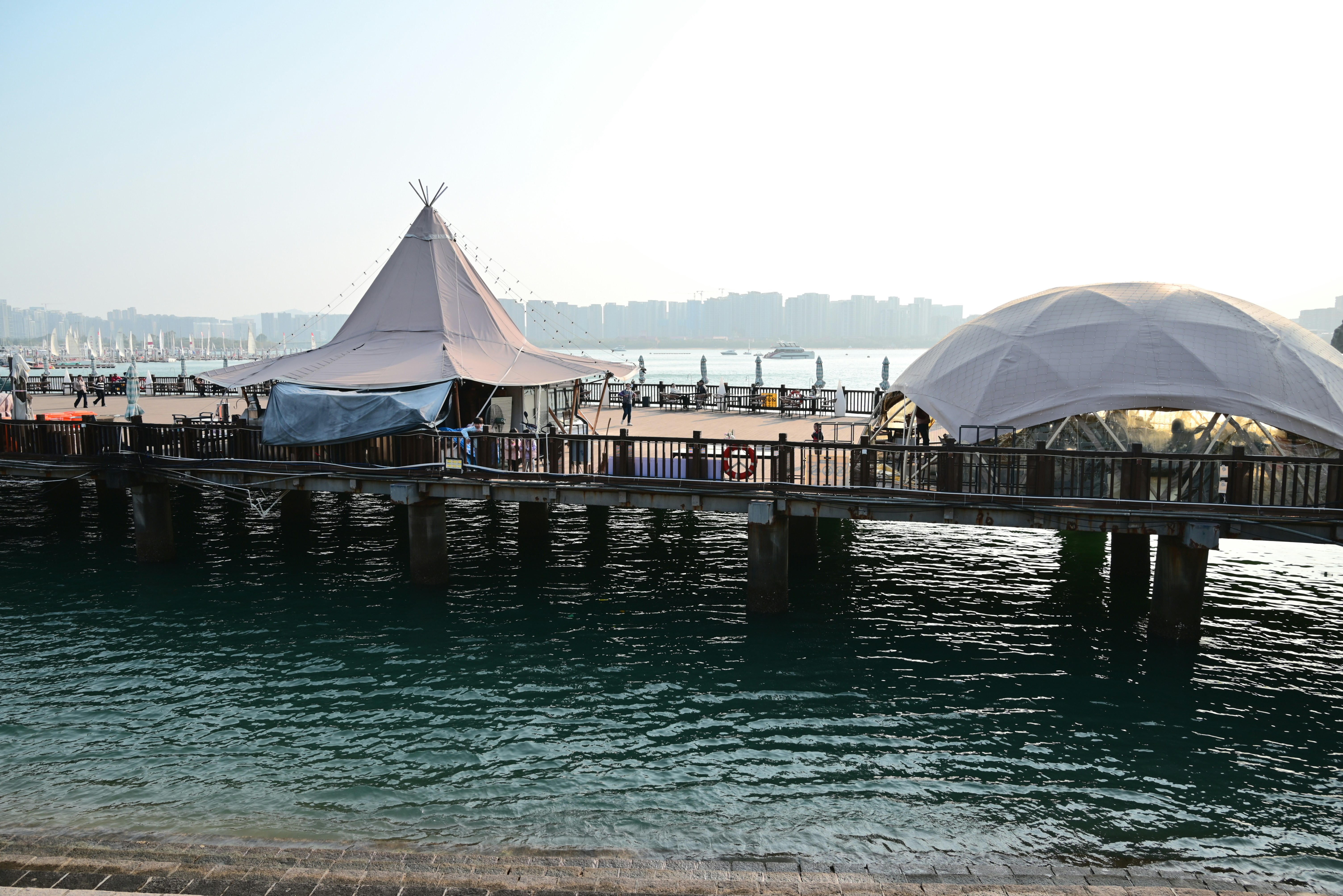 Harbor Pavilion at Dusk: Tents and Boardwalk over Gentle Waves
