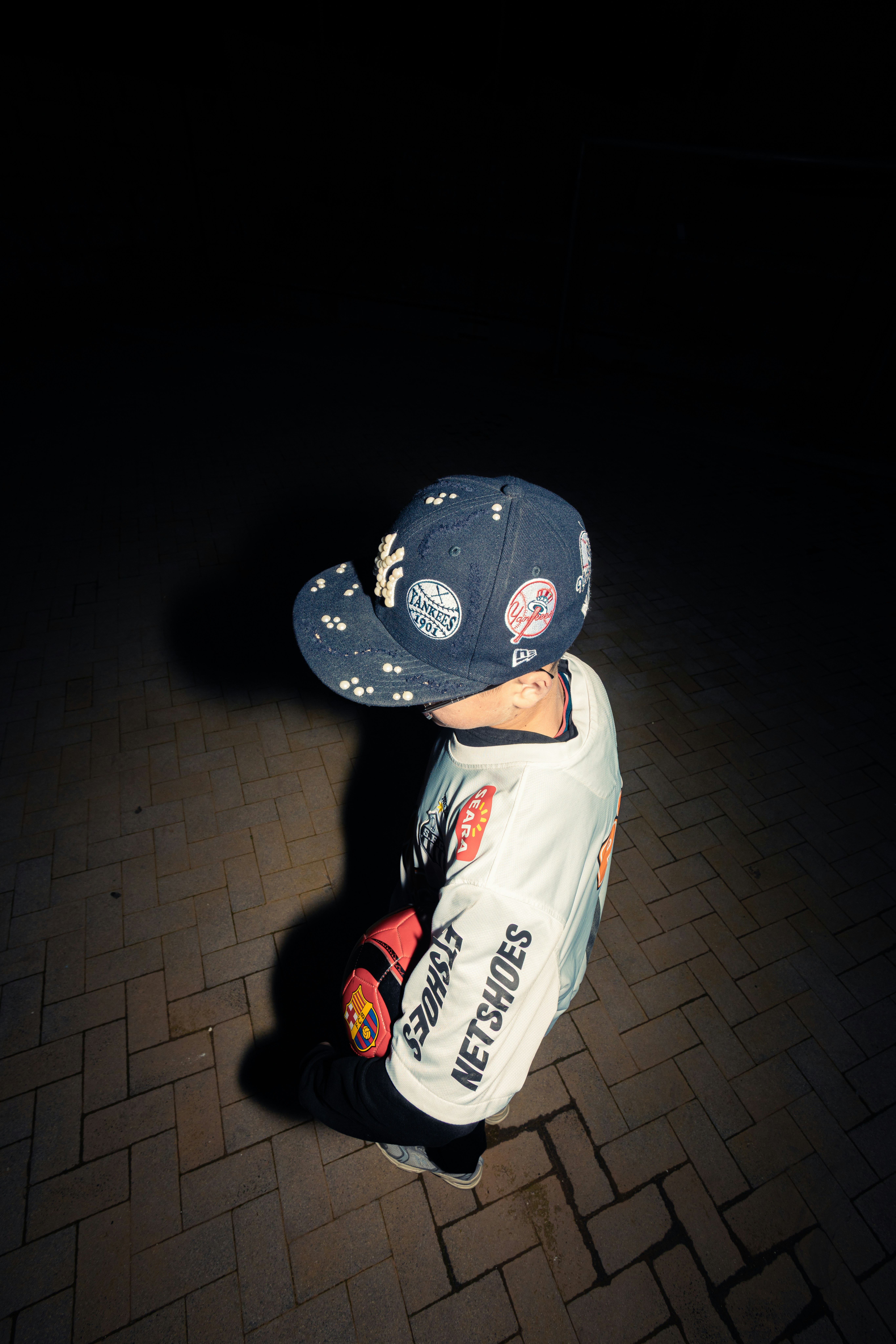 Night-time Portrait: A Youth in a Patched Baseball Cap