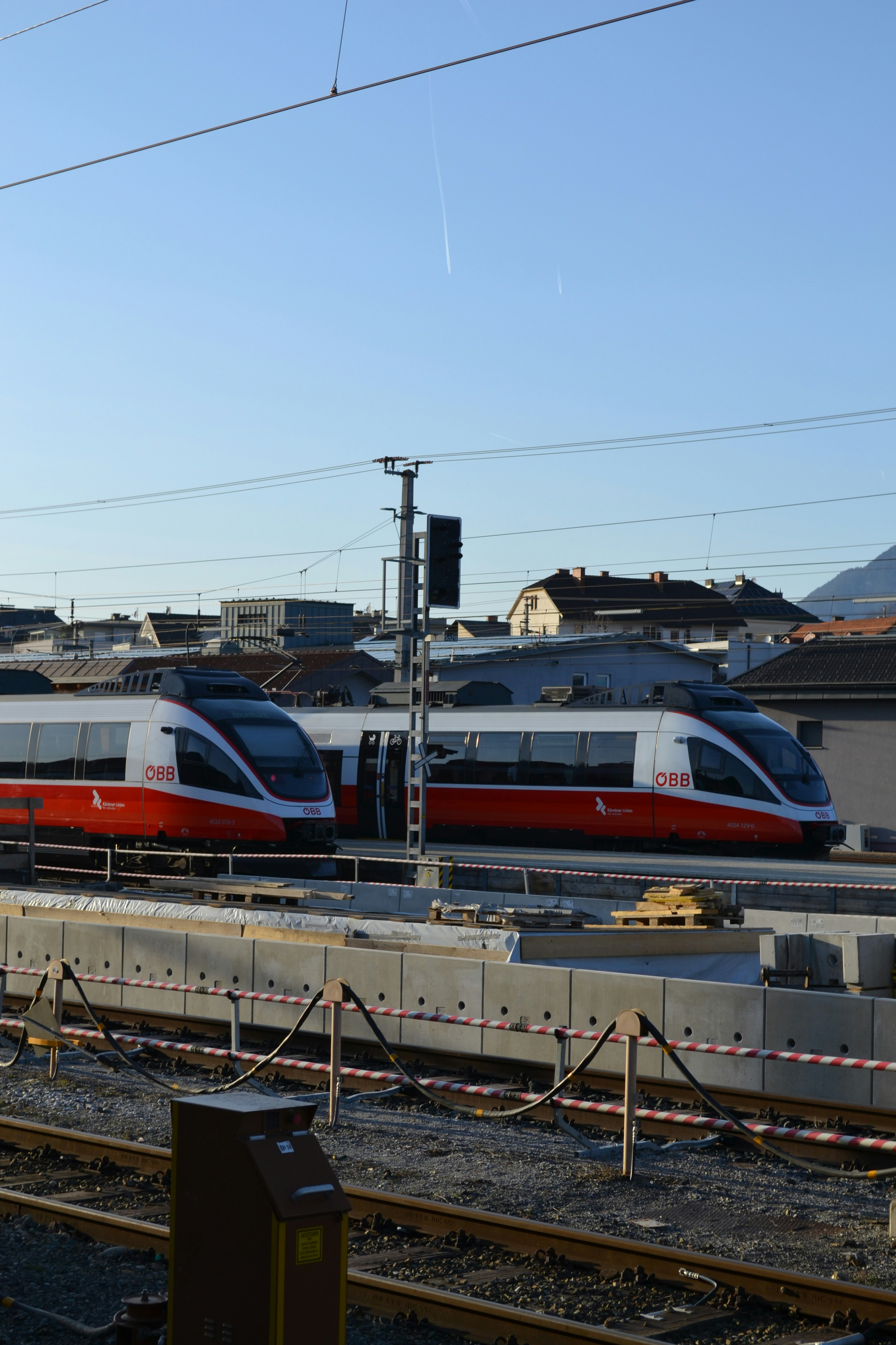 High-Speed Trade: A Pair of ÖBB Trains Rest Between Tracks