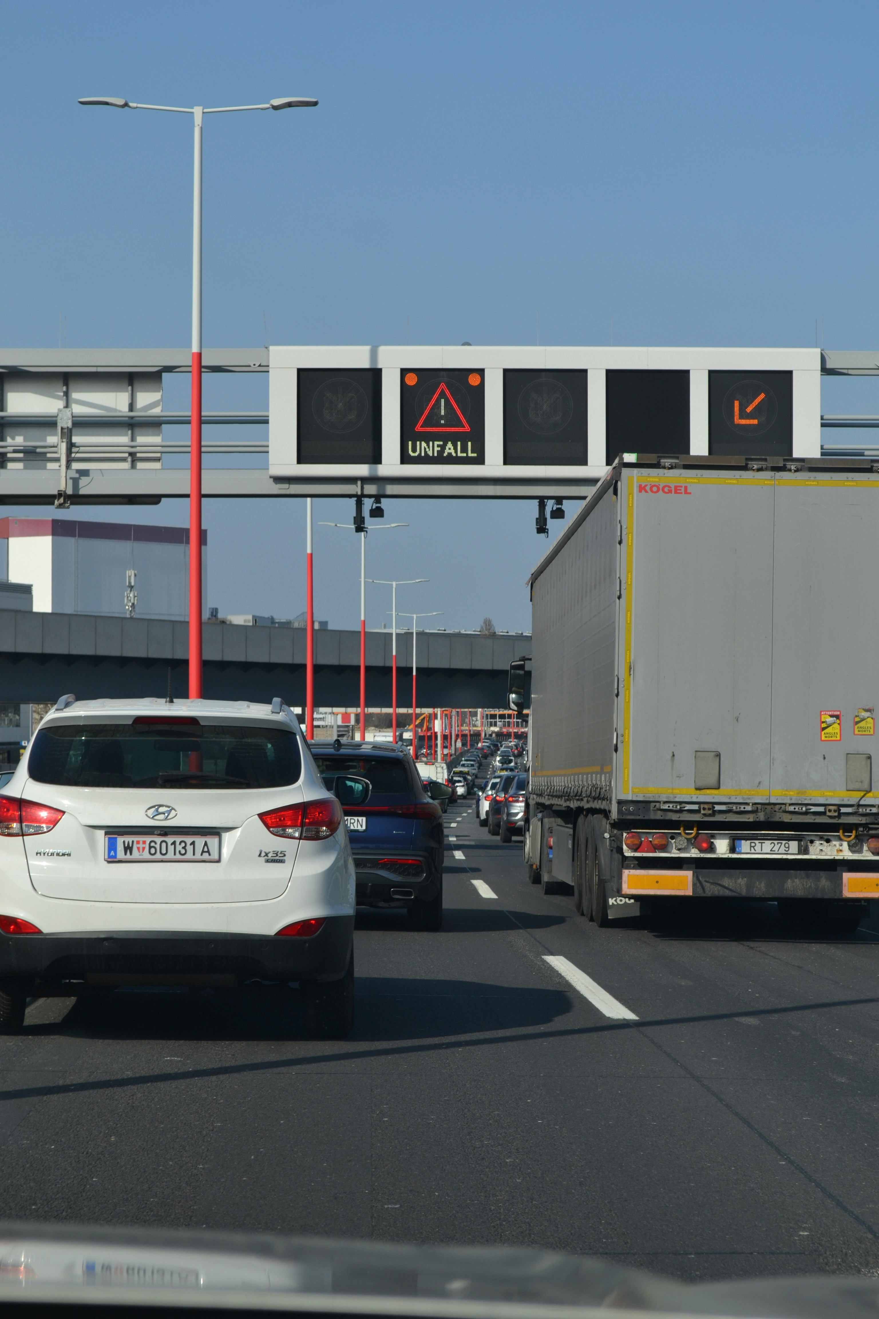 Highway Babel: Signage and Traffic Converge Under Blue Skies