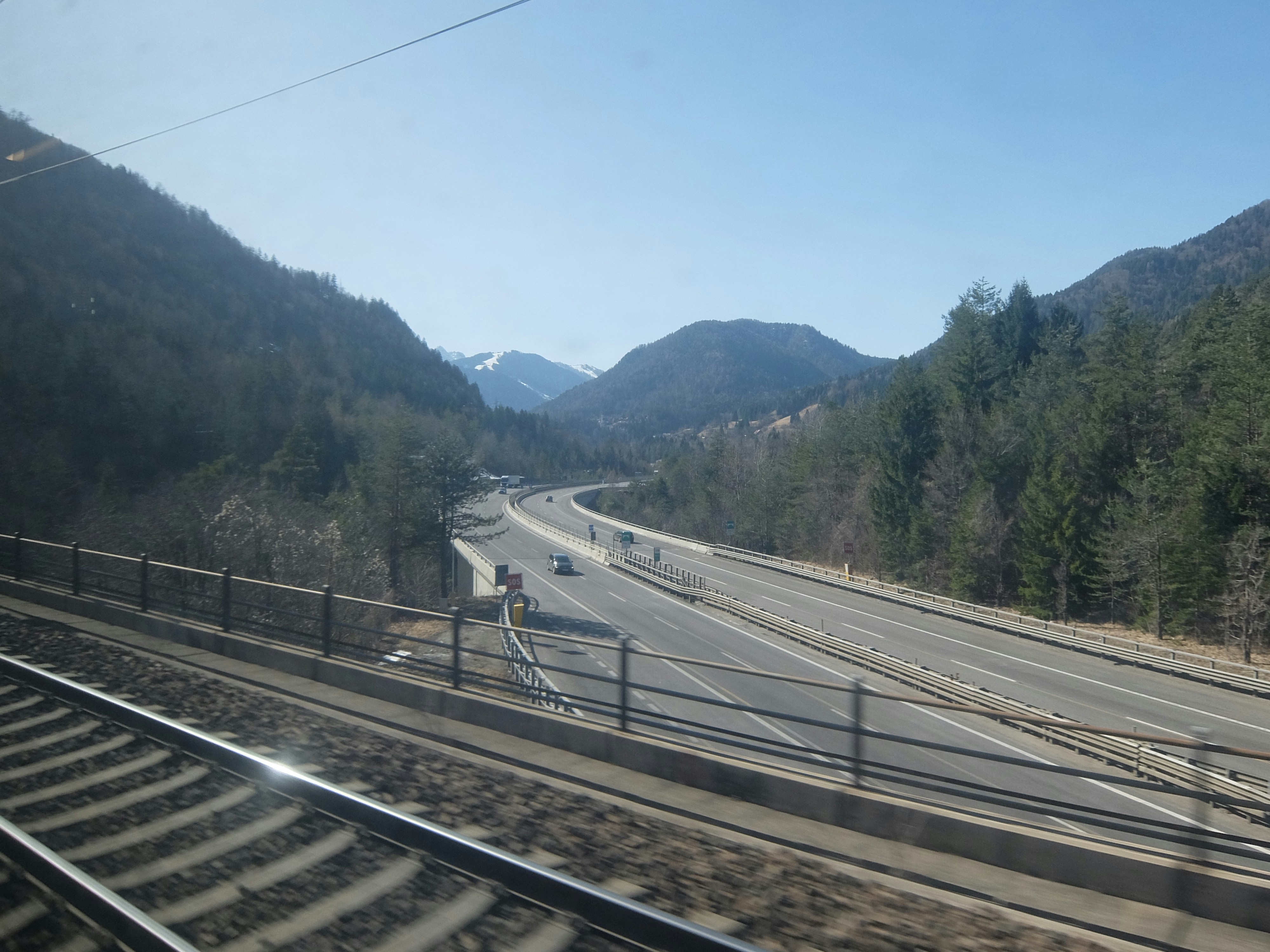 Highway through a forested mountain valley