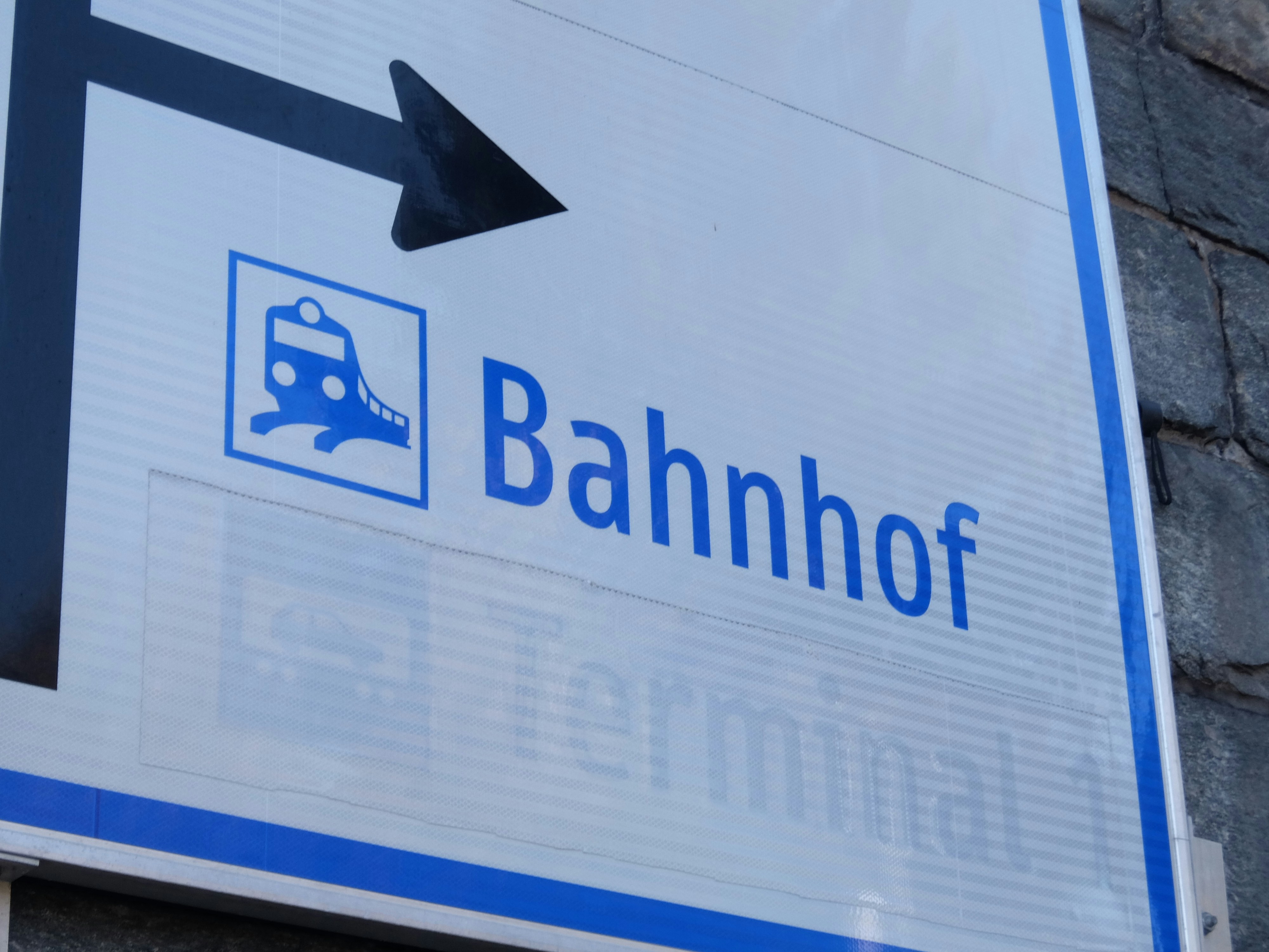 Railway Sign in Soft Focus: A City Stonewall Framed in Blue