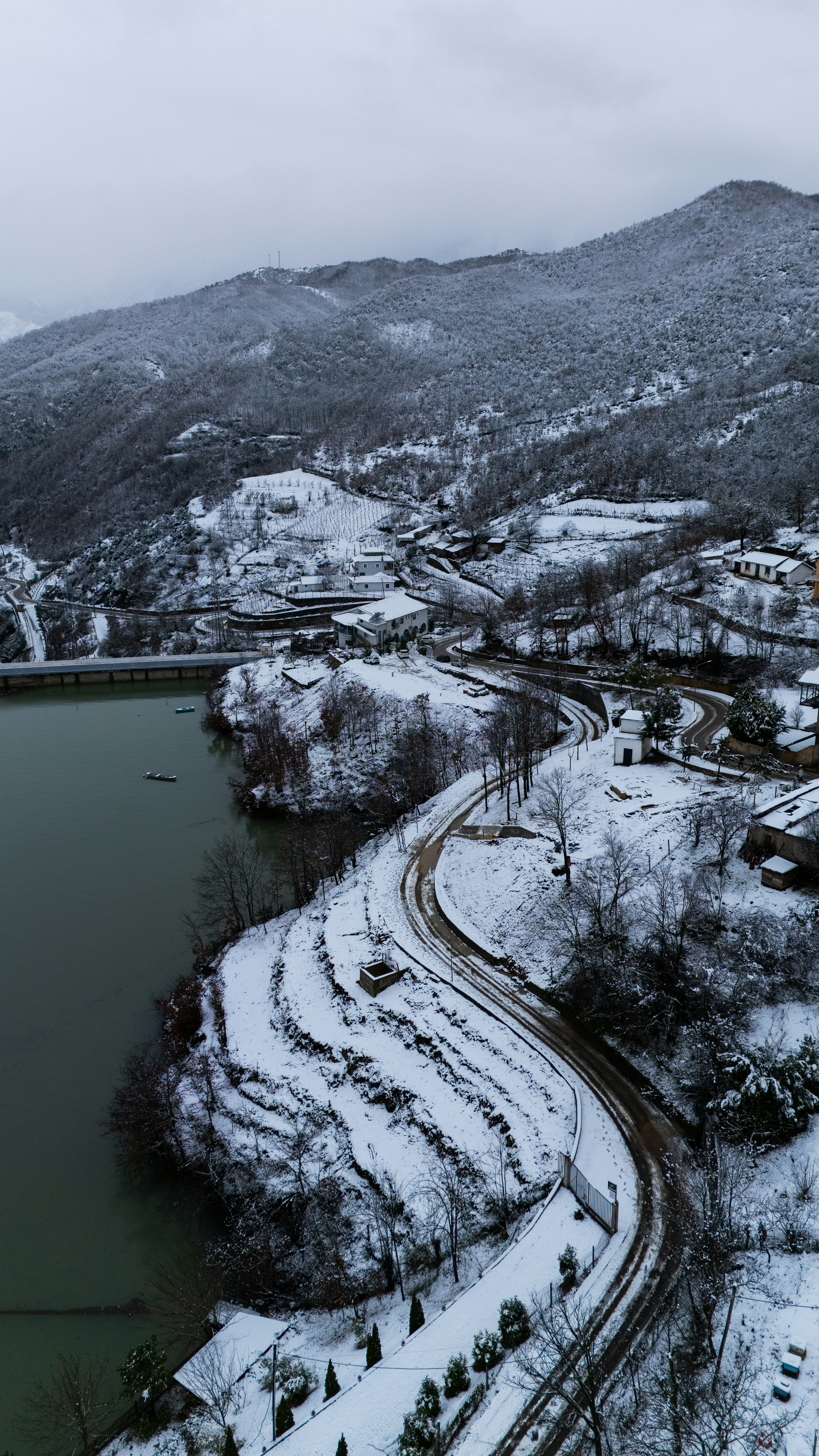 Snowbound Valley: A Meandering Road Through Quiet Winter Hills